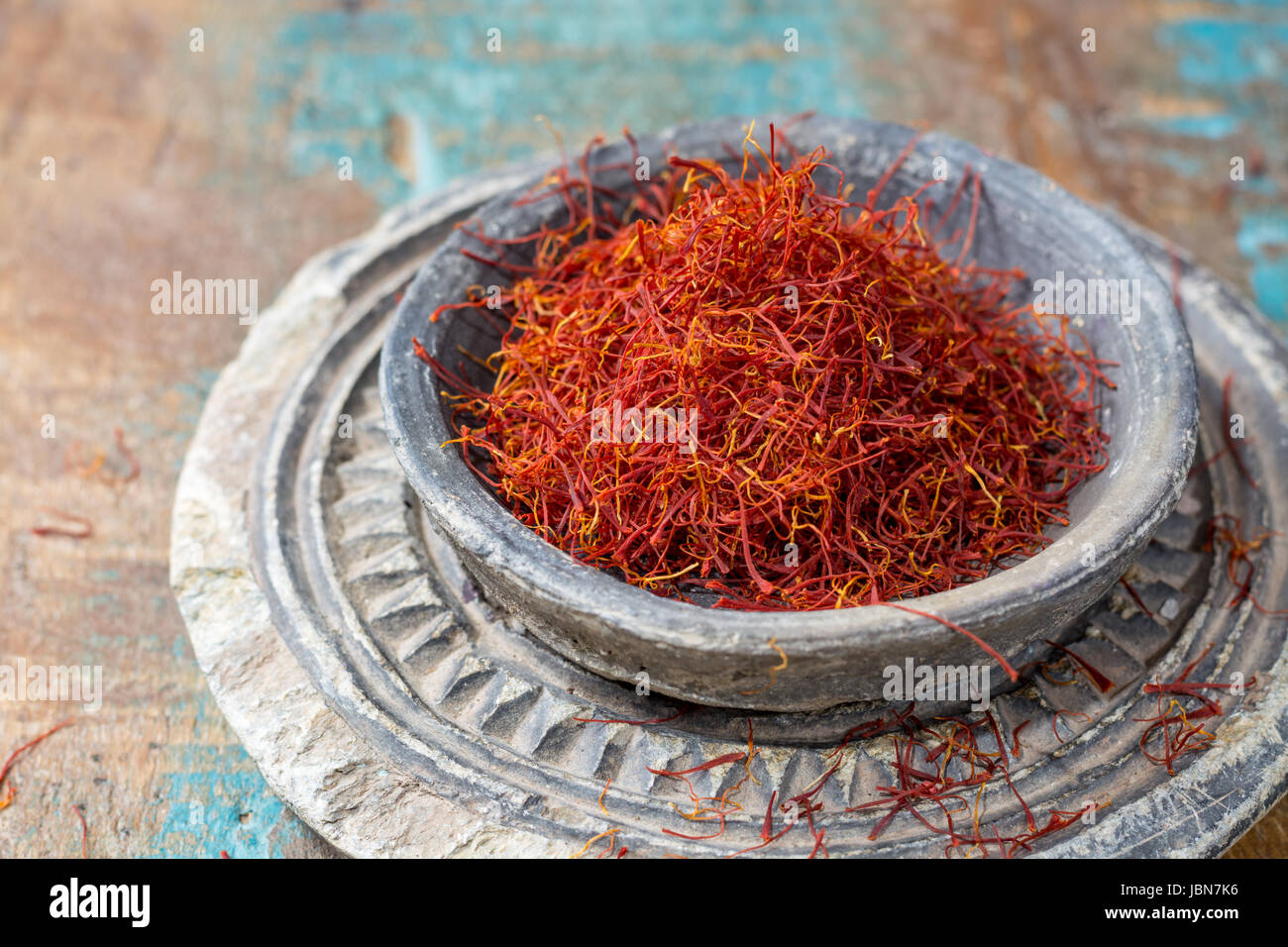 Dried organic red saffron Spice on wooden background with spoon Stock ...