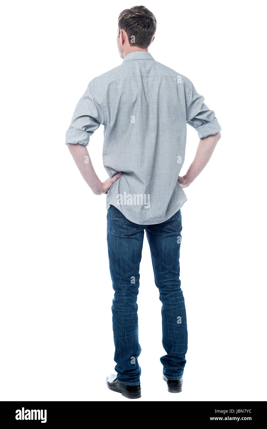 Back pose, full length shot of a young man looks ahead Stock Photo - Alamy