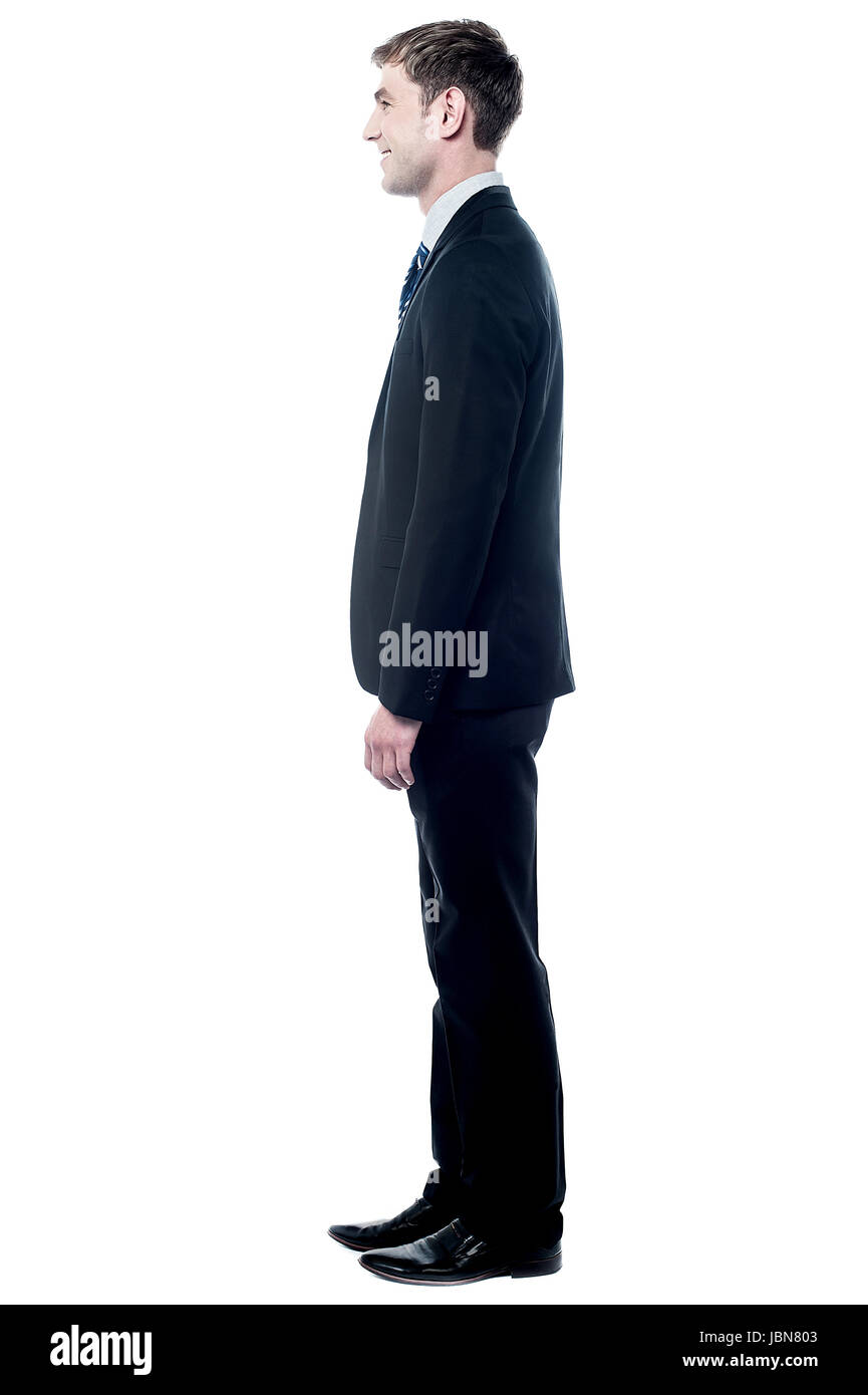 Side view of businessman standing isolated on white Stock Photo - Alamy