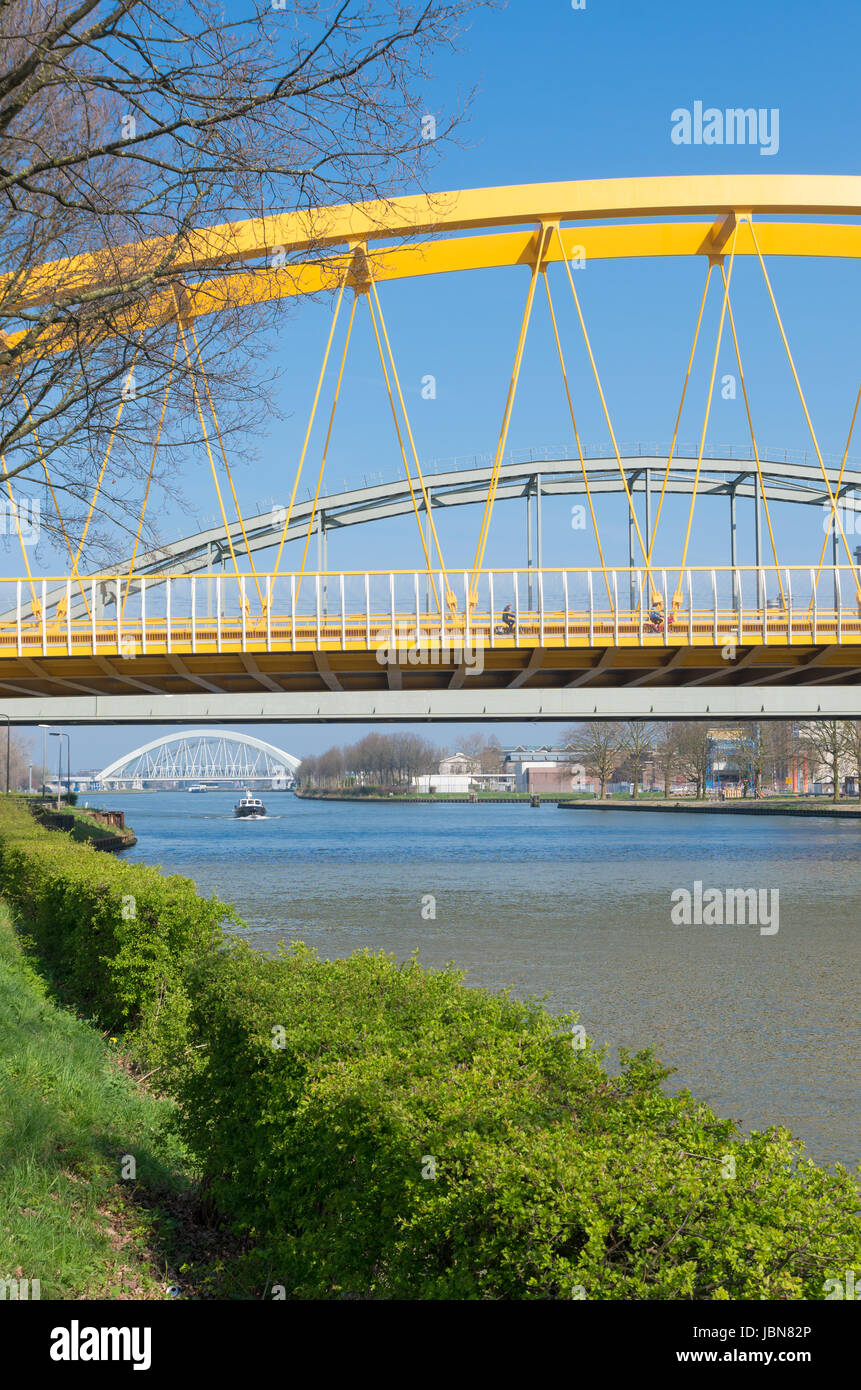 yellow arch bridge in Utrecht, netherlands. The Hogeweide Bridge is a ...