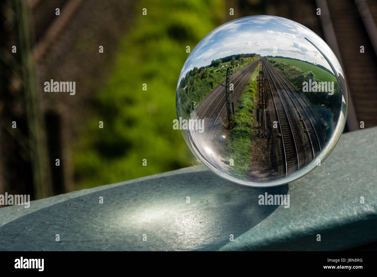rails with glass ball Stock Photo - Alamy