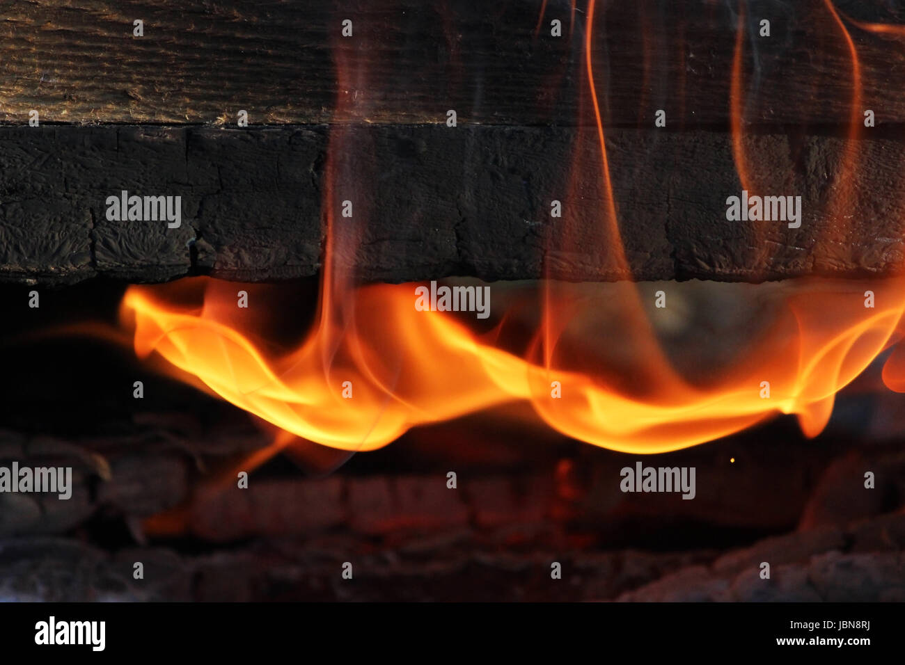A bonfire in which old painted boards are enveloped in fire Stock Photo ...