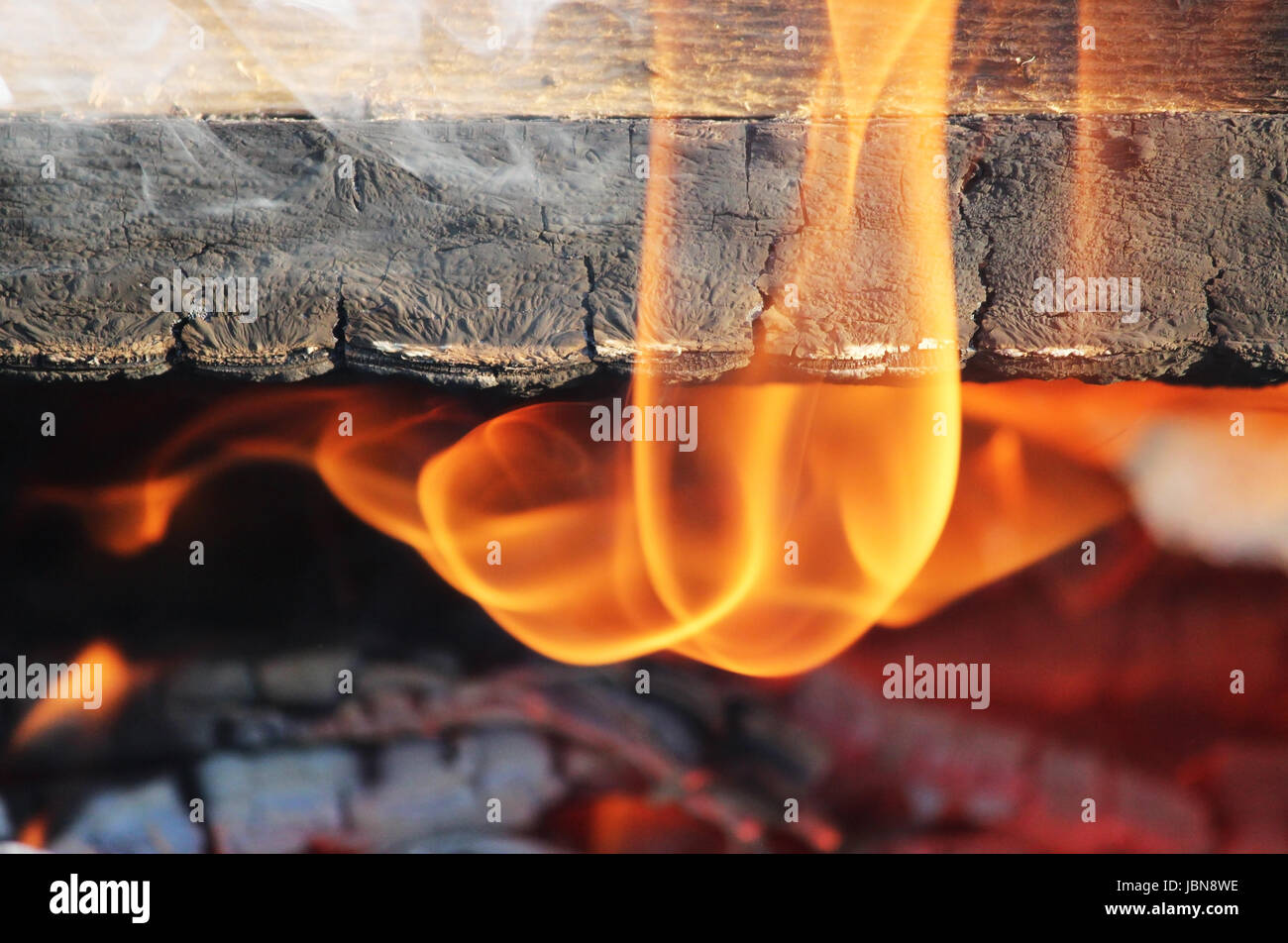 A bonfire in which old painted boards are enveloped in fire Stock Photo ...
