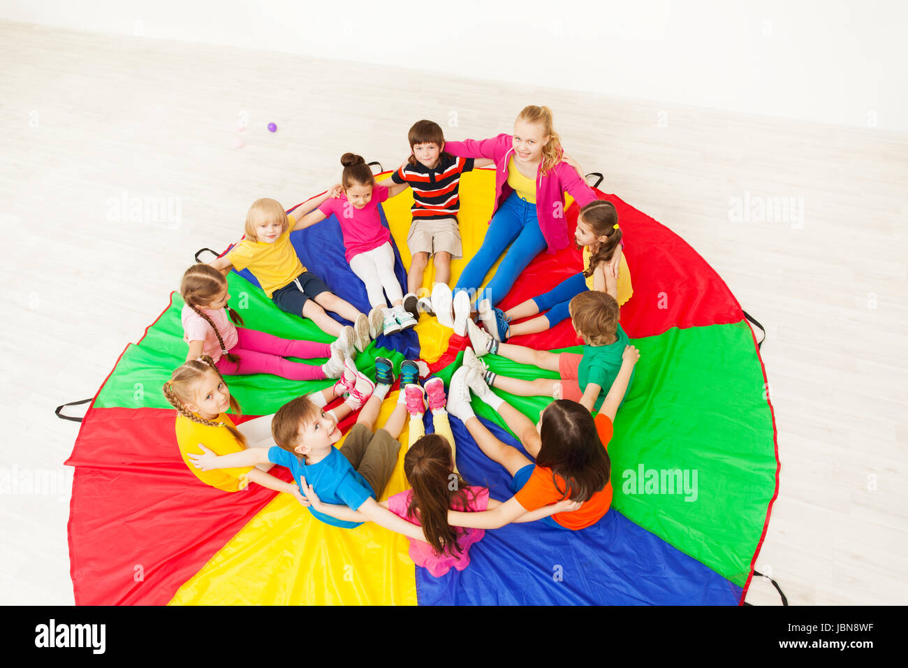 Group of children playing circle games hi-res stock photography and ...