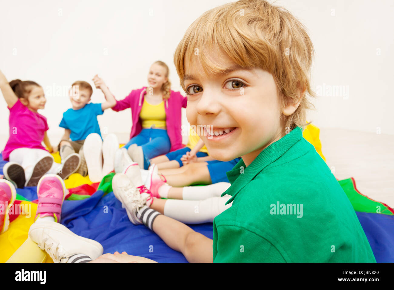 Group of children playing circle games hi-res stock photography and ...