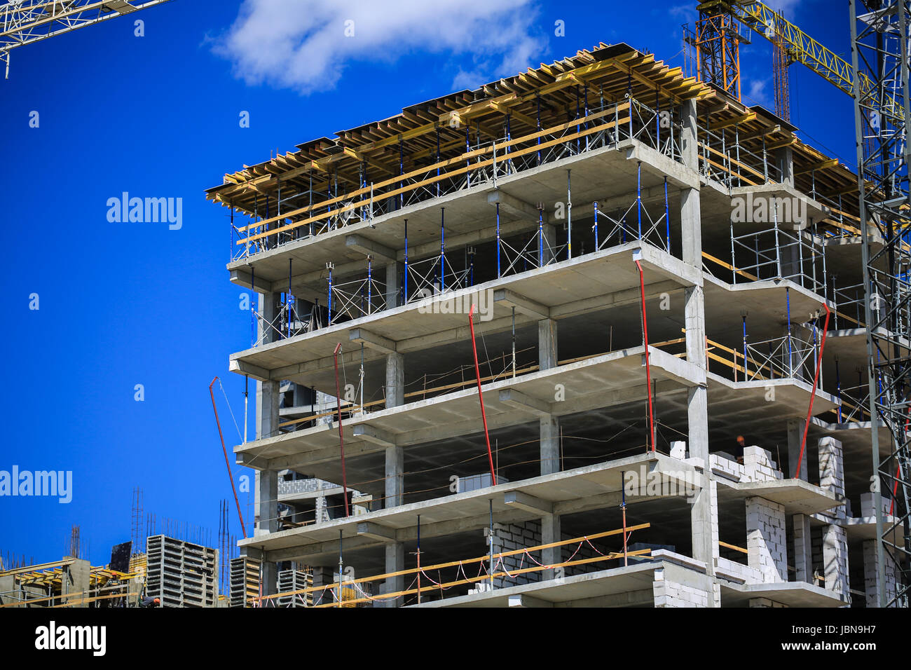 Construction concept. A new building under construction against the sky ...