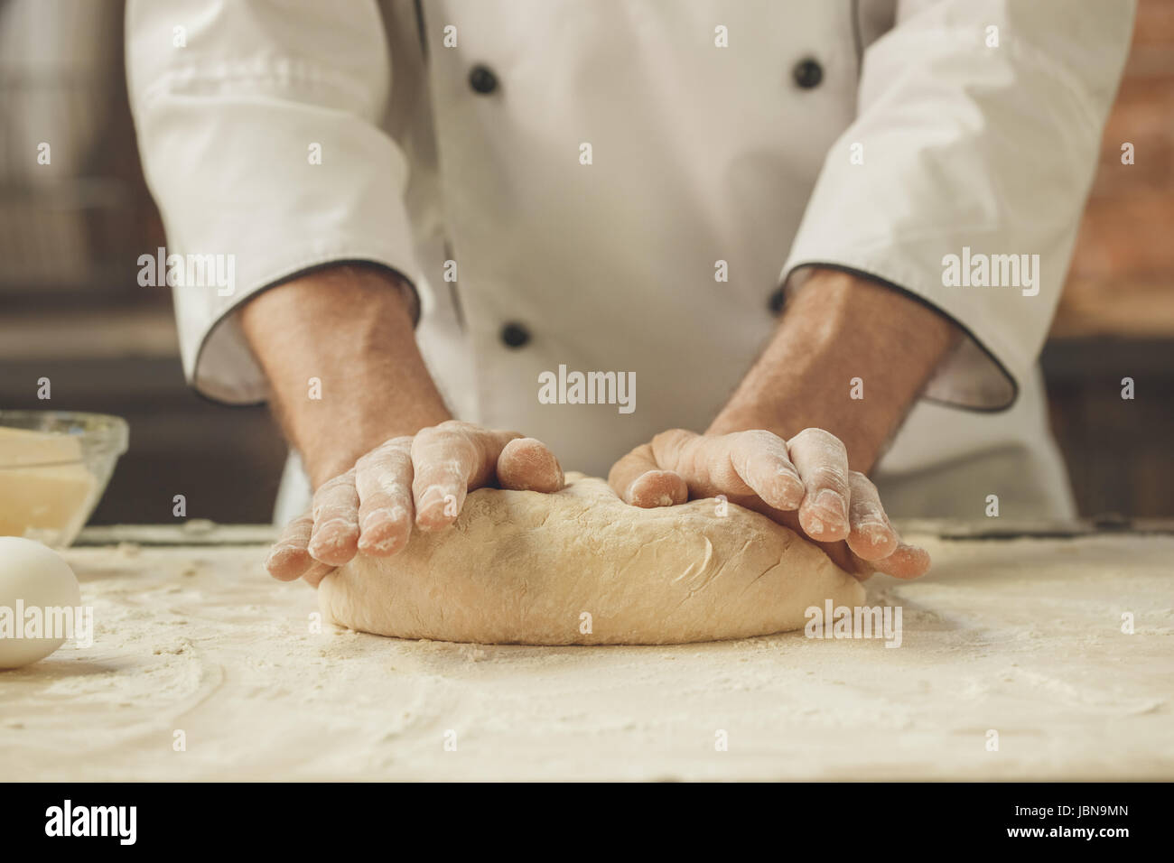 Bakery chef cooking bake in the kitchen professional Stock Photo - Alamy