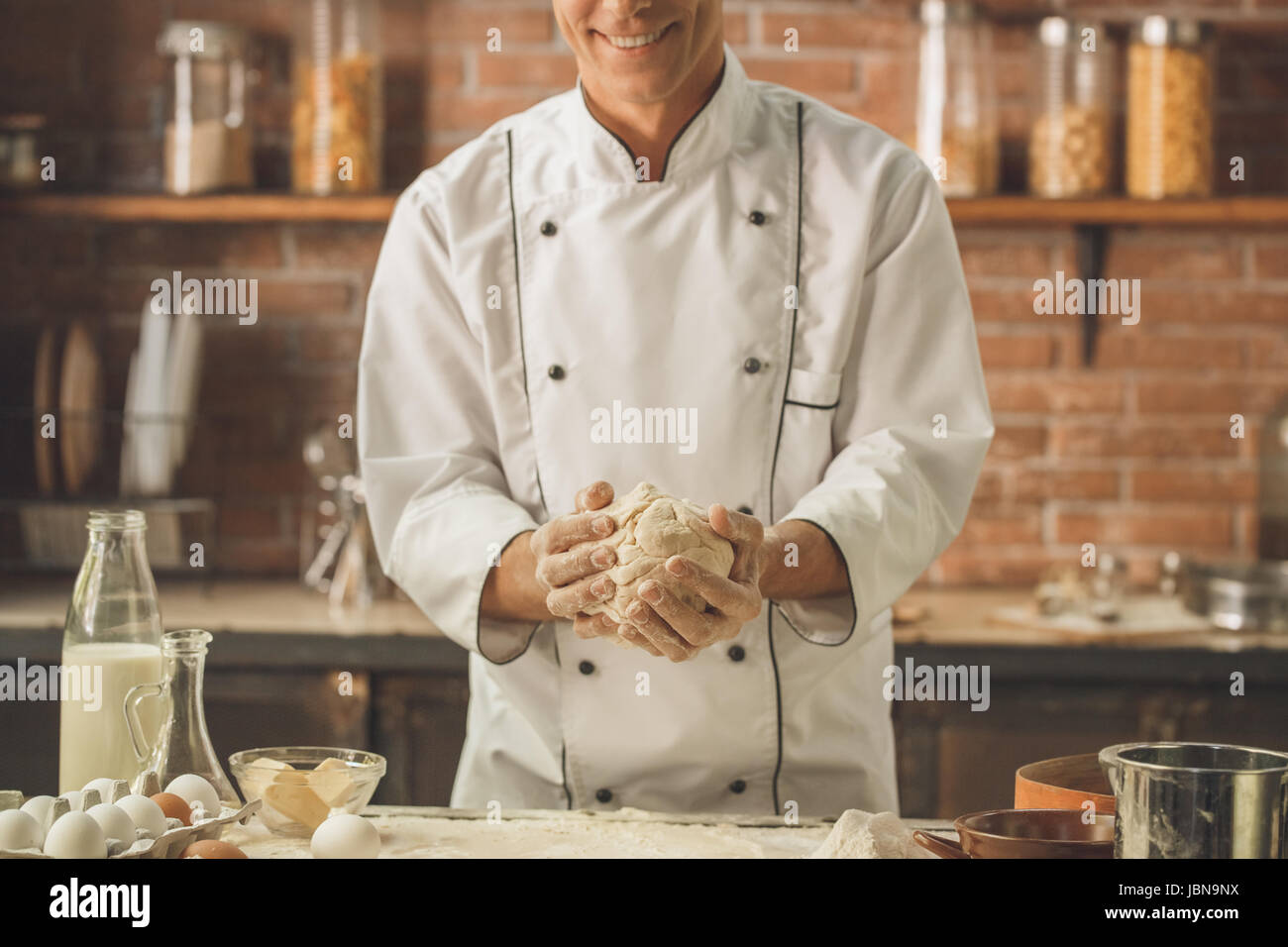 Bakery chef cooking bake in the kitchen professional Stock Photo - Alamy