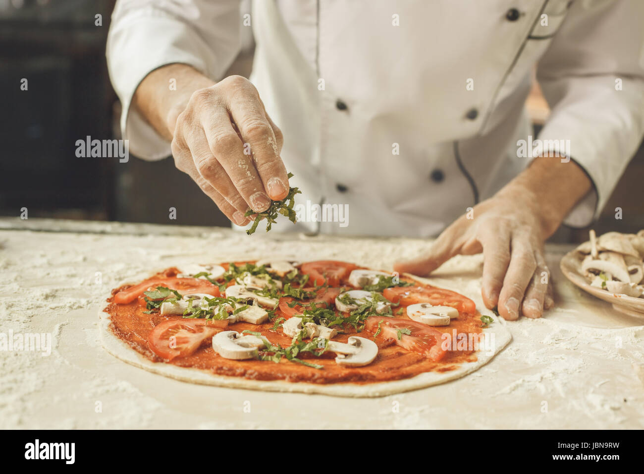 Bakery chef cooking bake in the kitchen professional Stock Photo - Alamy