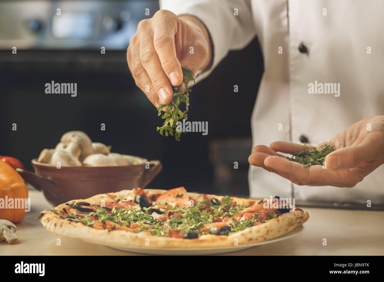 Bakery chef cooking bake in the kitchen professional Stock Photo - Alamy