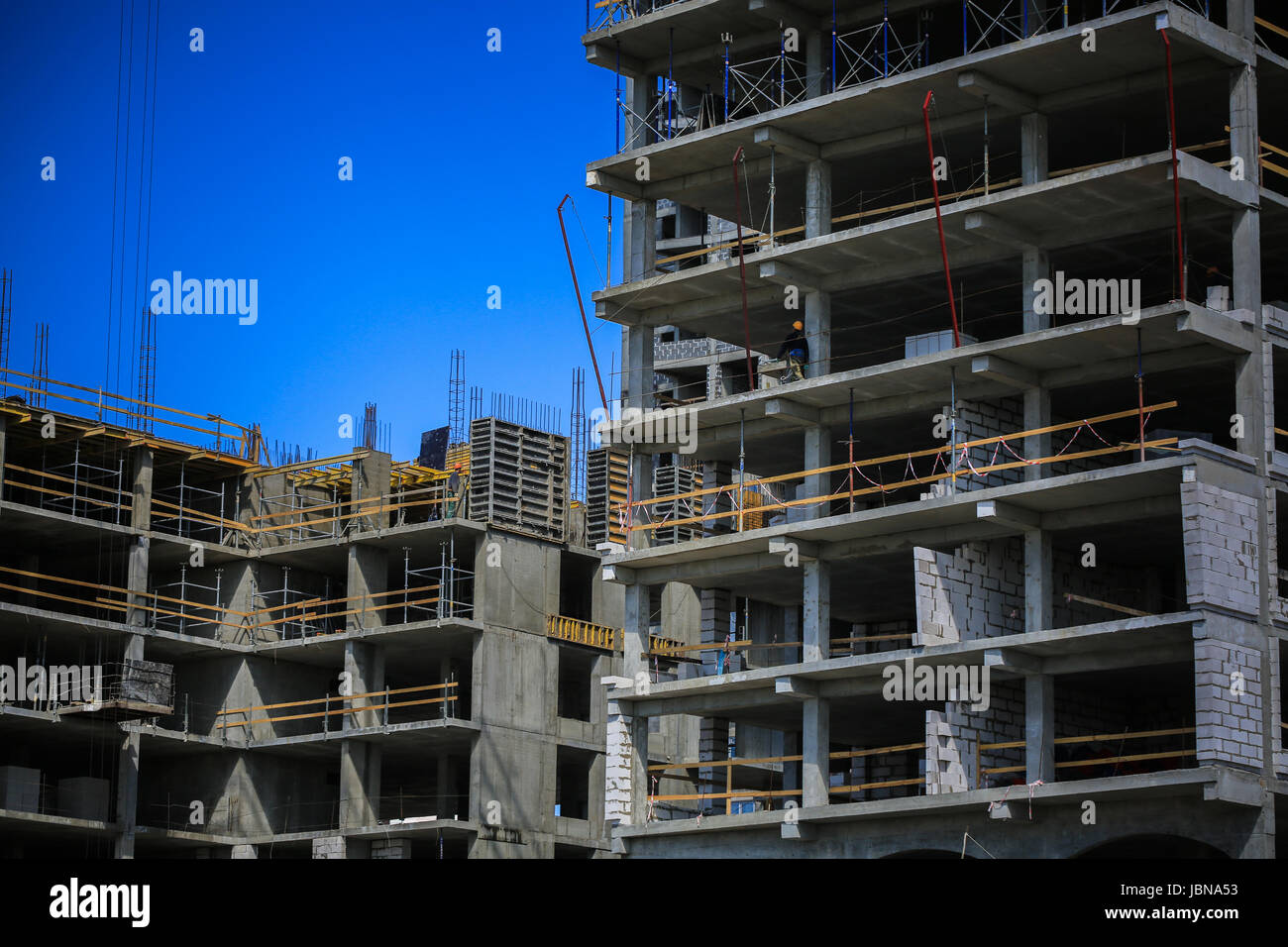 Construction concept. A new building under construction against the sky ...