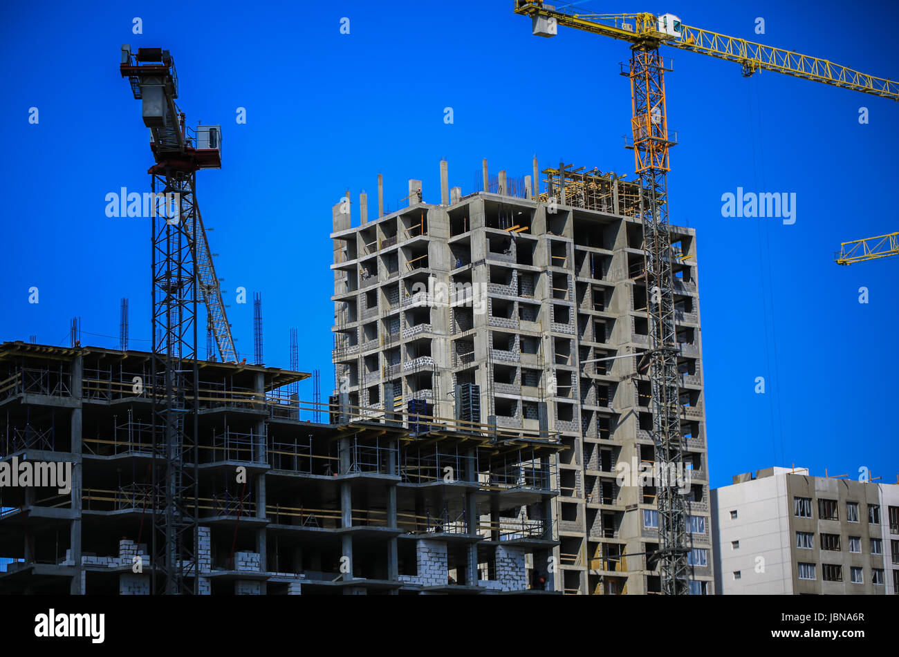 Construction concept. A new building under construction against the sky ...