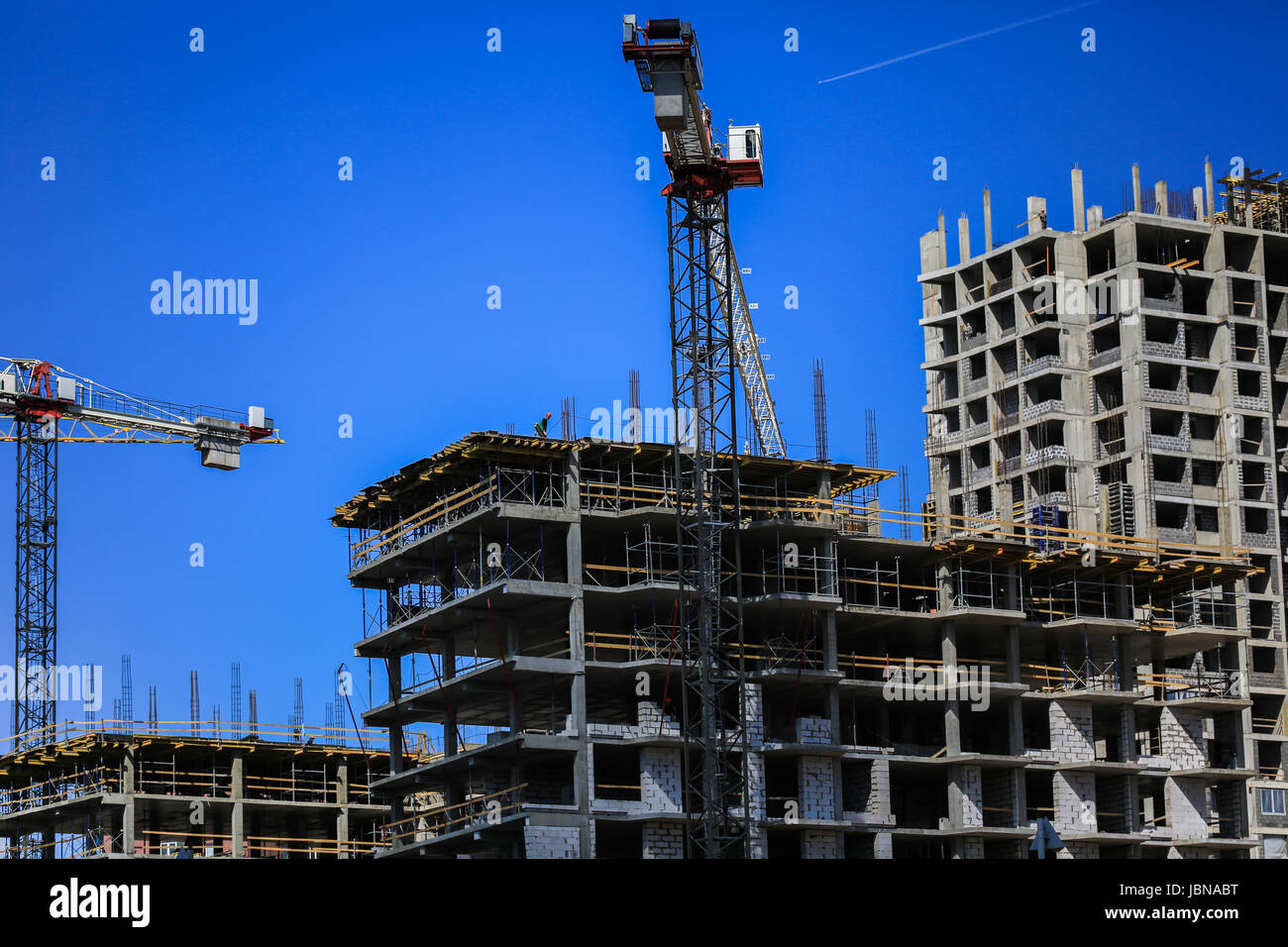 Construction concept. A new building under construction against the sky ...