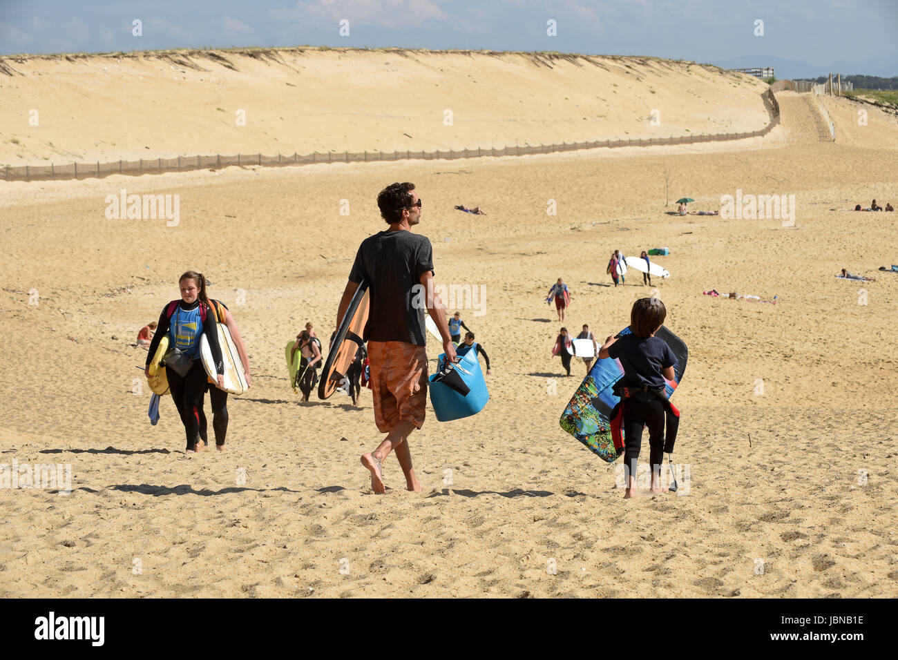 Surfers leaving Capbreton beach in South Western France Stock Photo - Alamy