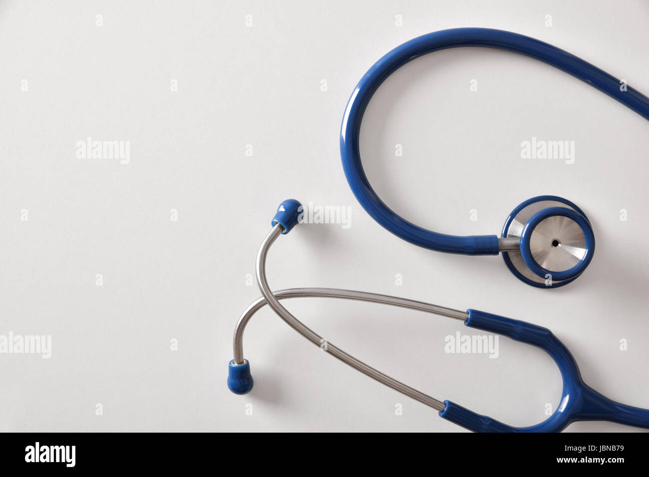 Blue stethoscope on white table. Close up. Top view. Horizontal ...