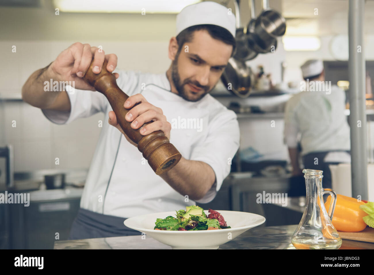 Man japanese restaurant chef cooking in the kitchen Stock Photo - Alamy