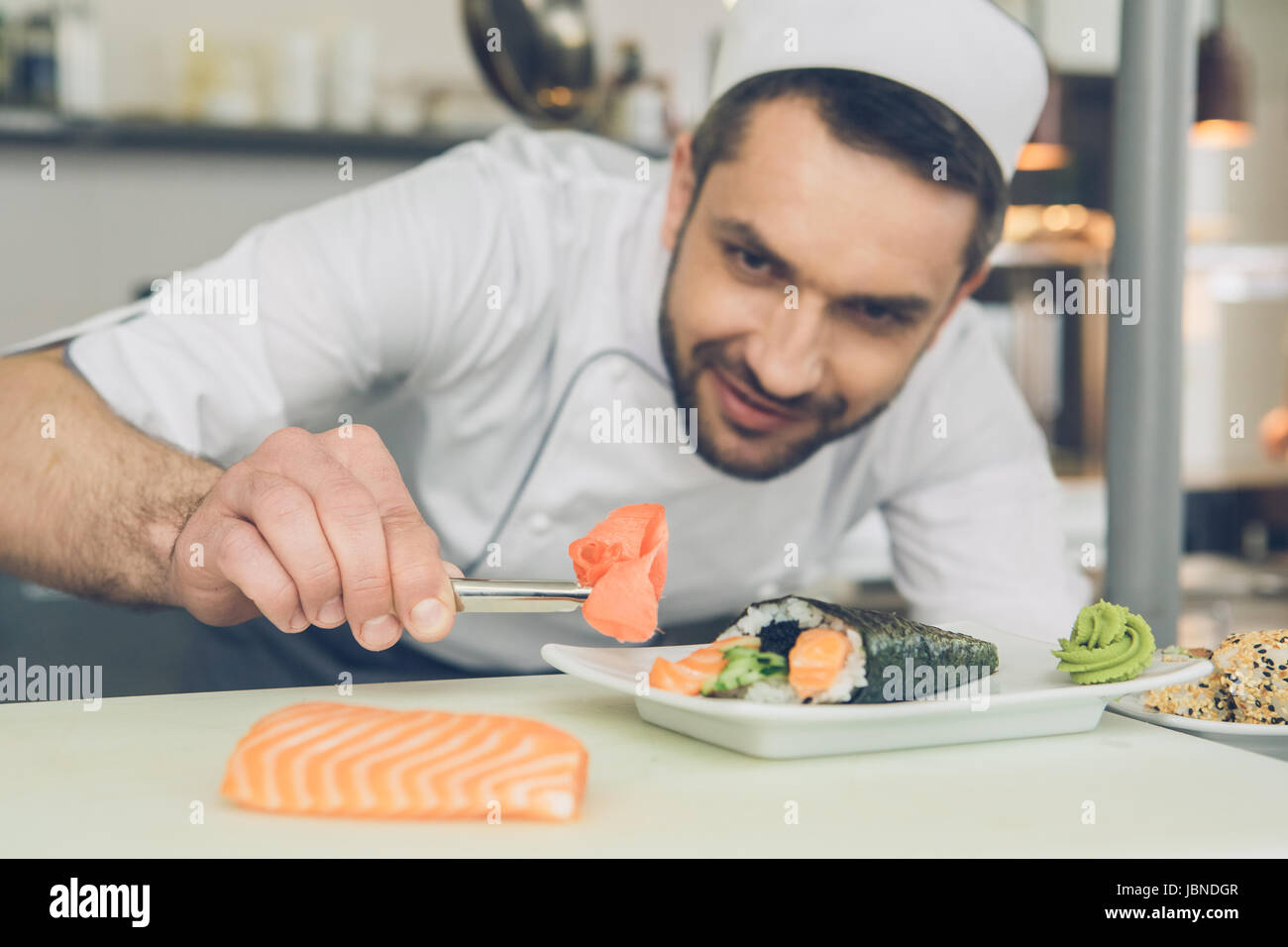 Man japanese restaurant chef cooking in the kitchen Stock Photo - Alamy