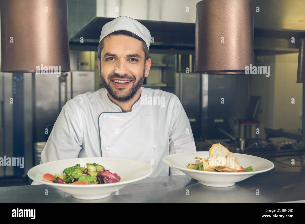 Man japanese restaurant chef cooking in the kitchen Stock Photo - Alamy