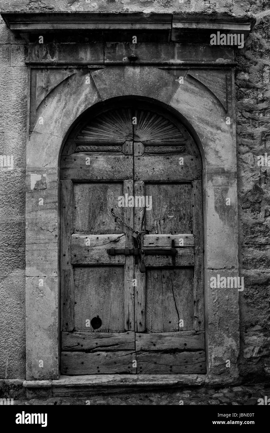 Chained Door- A chained, antiquated door with hand carved stone and ...