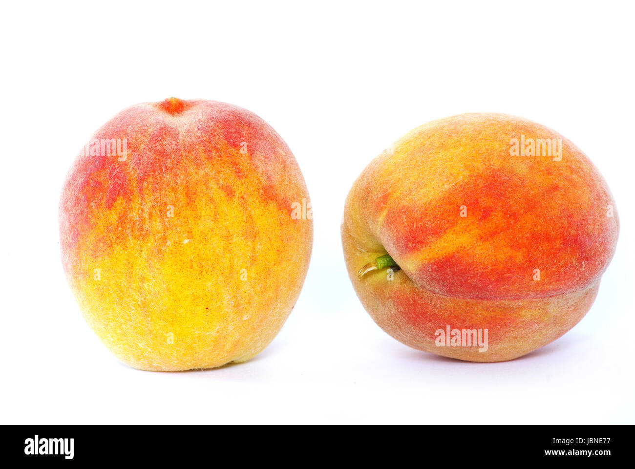 two peach isolated on white Stock Photo - Alamy
