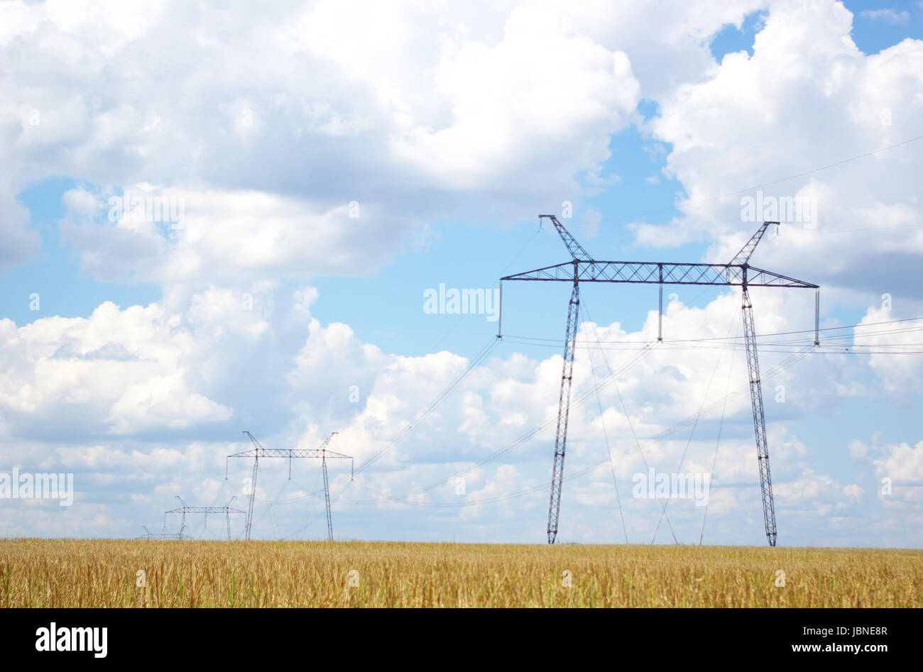 electrical powerlines with blue sky and white clouds Stock Photo - Alamy