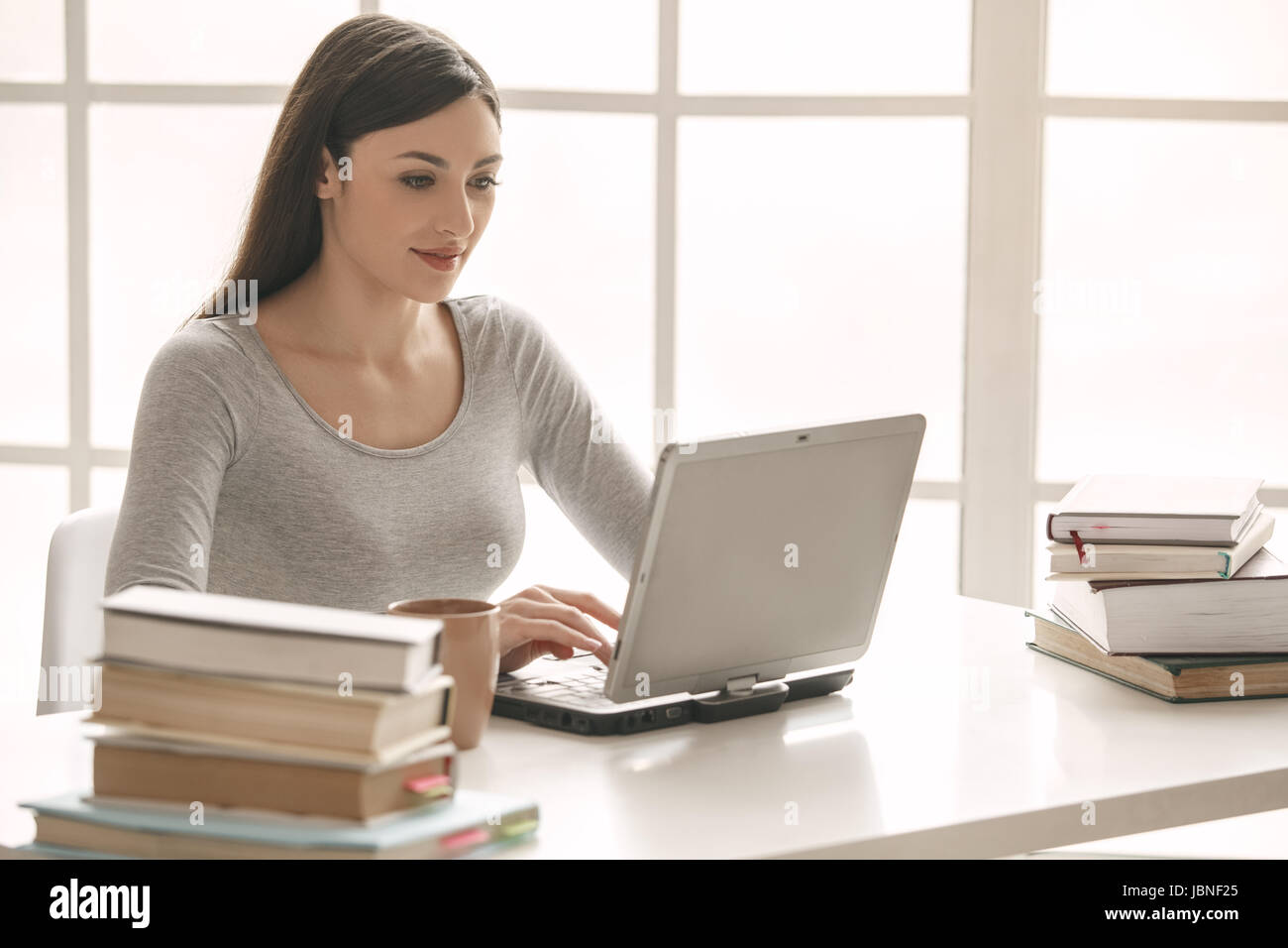 Young woman study at home alone education Stock Photo - Alamy