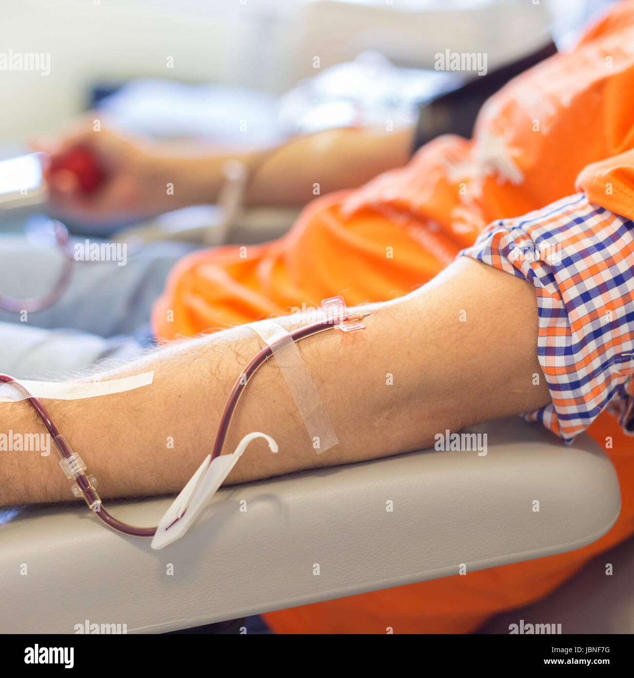 Blood donor at donation with a bouncy ball holding in hand Stock Photo ...