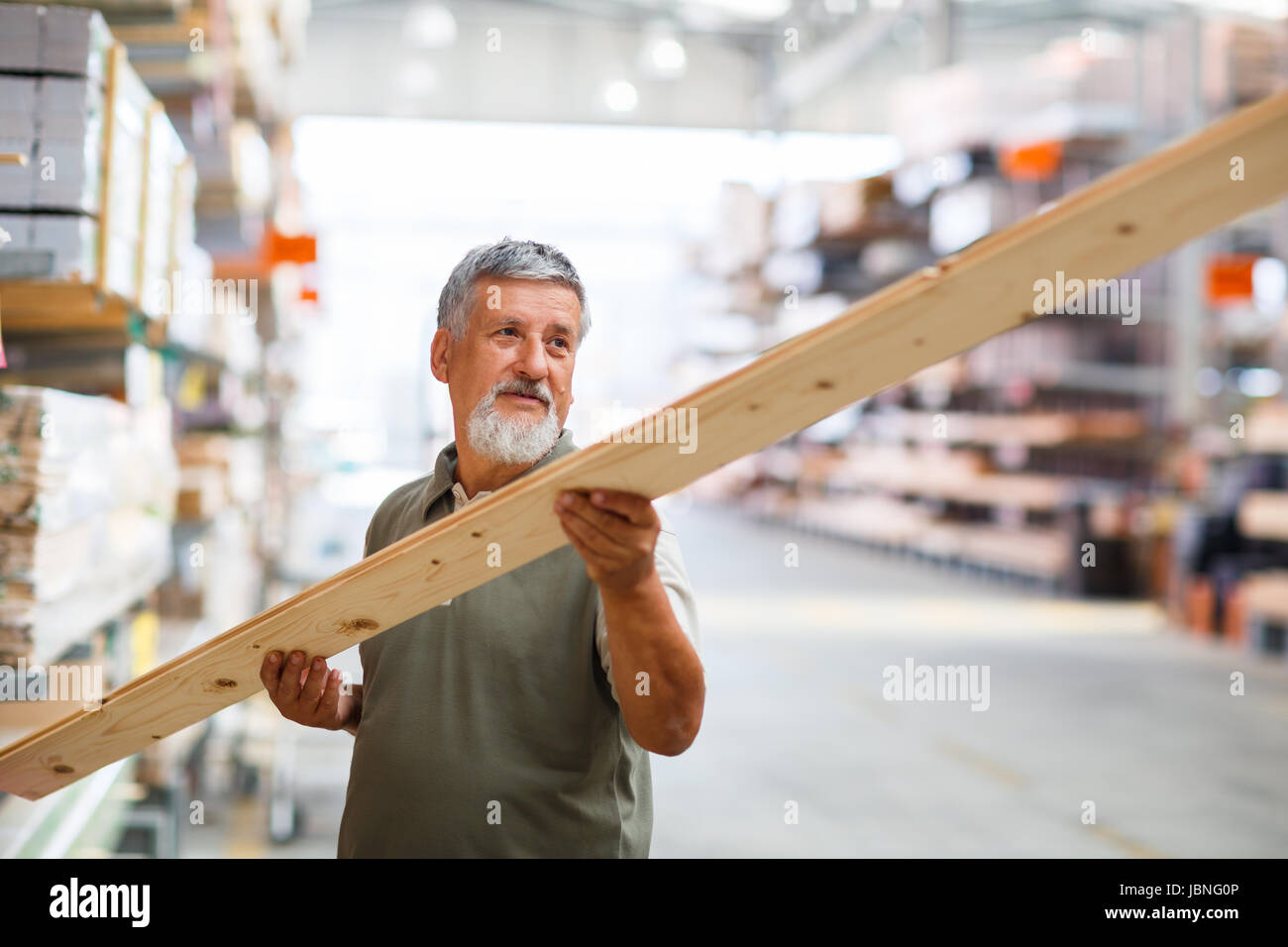 Man buying construction wood in a DIY store for his DIY home re ...