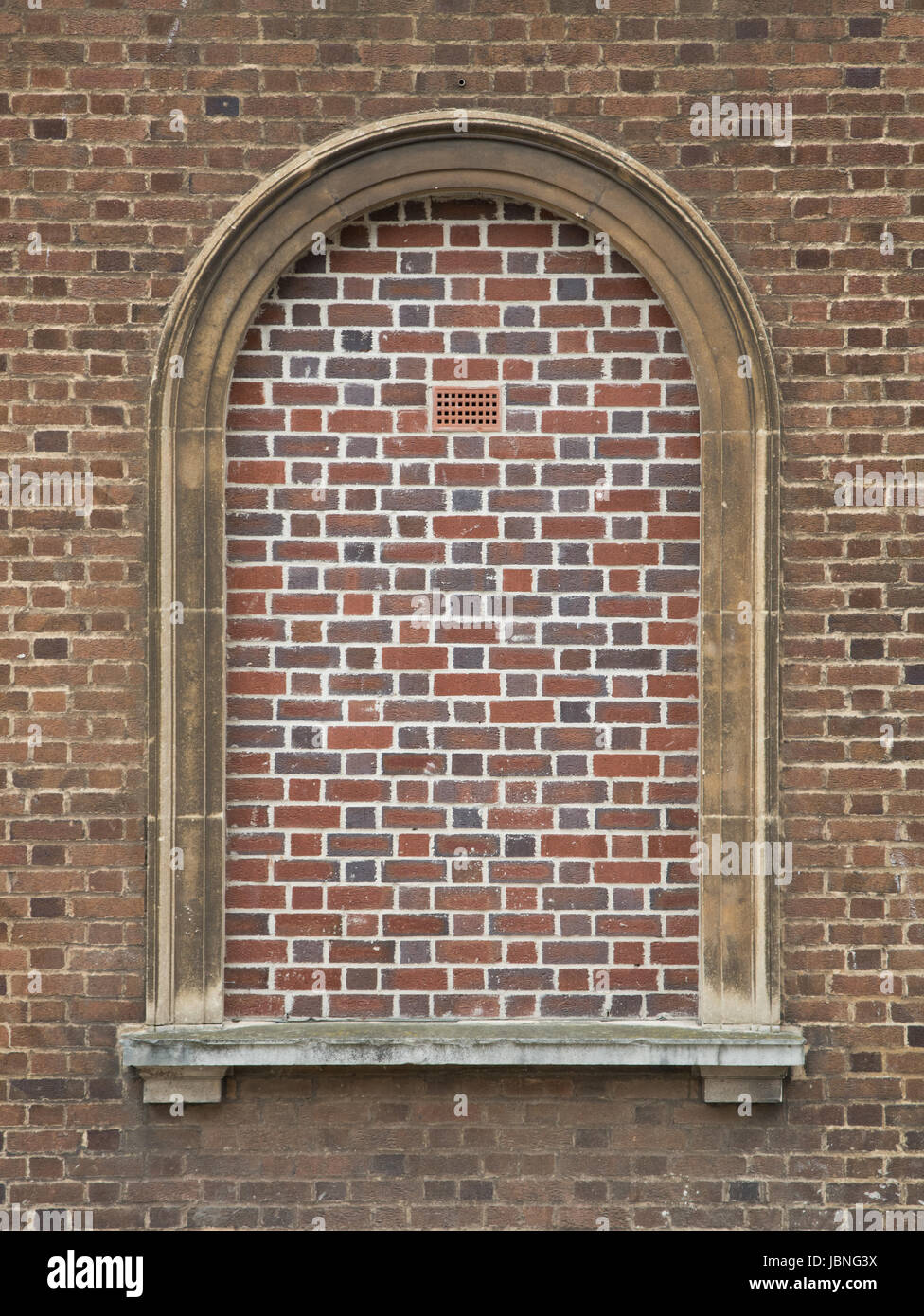A Bricked In Arched Window with a breeze brick added for ventilation ...