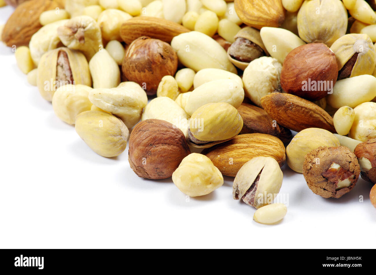 Assorted mixed nuts on white background Stock Photo - Alamy
