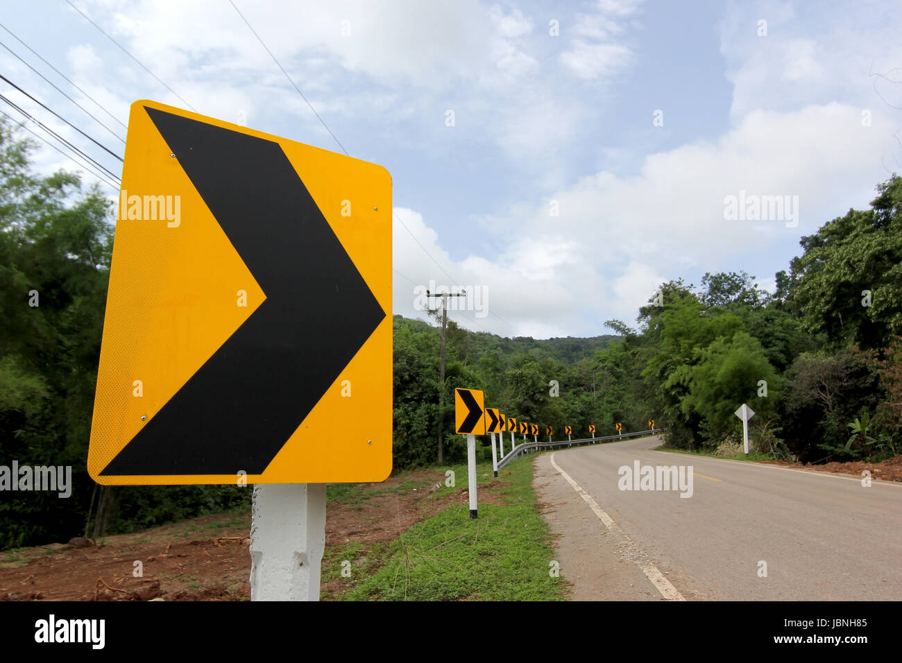warning curve road sign on countryside road Stock Photo - Alamy