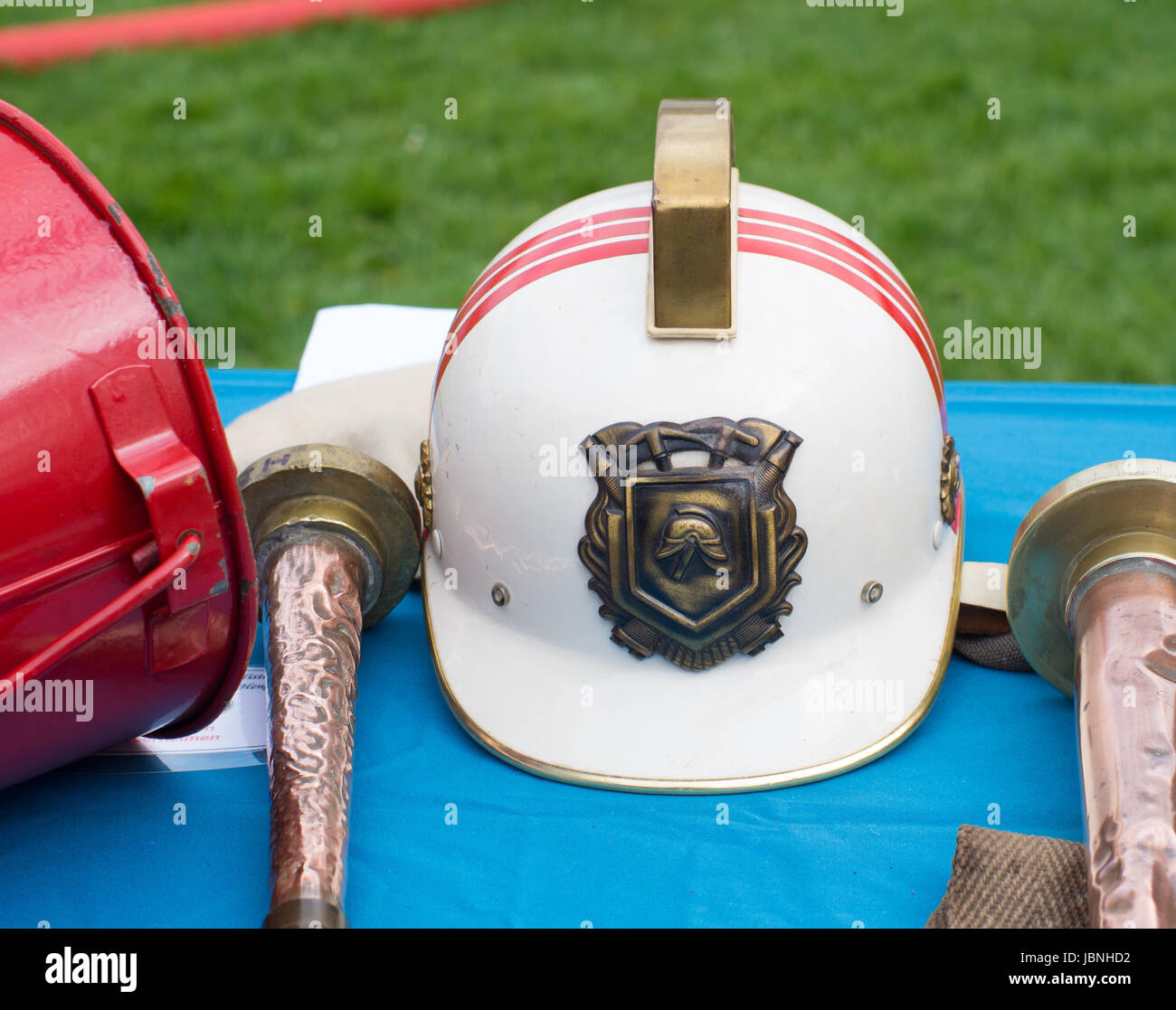 antique firefighter helmet on a table Stock Photo - Alamy