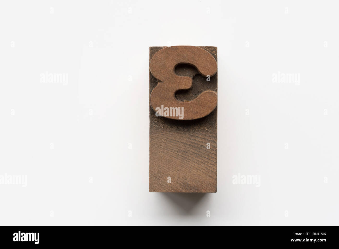 Old letterpress number 3 printing block isolated on a white background ...