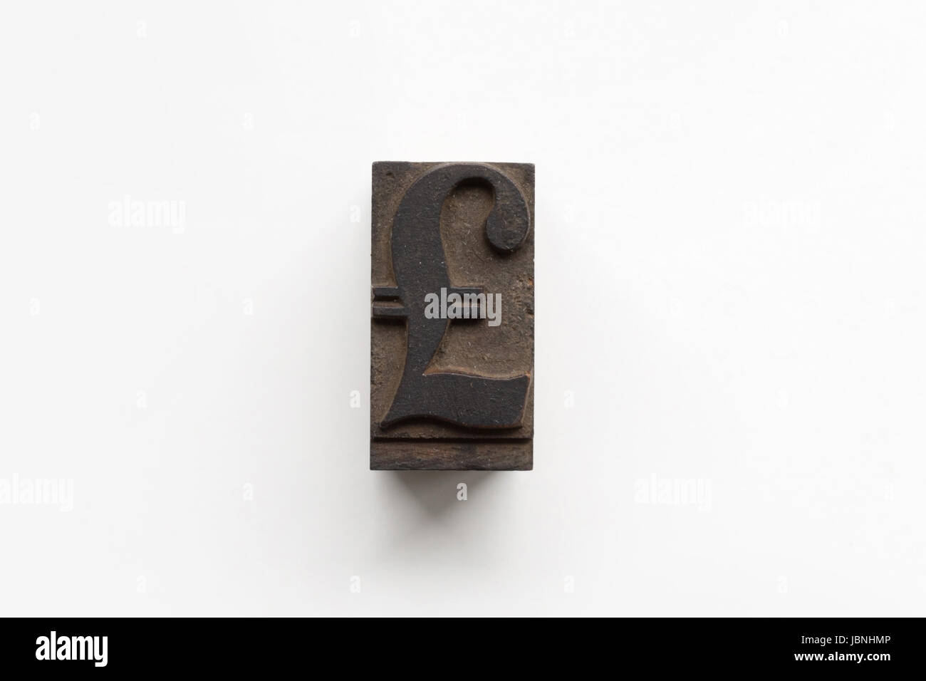 Old letterpress pound sign printing block isolated on a white ...