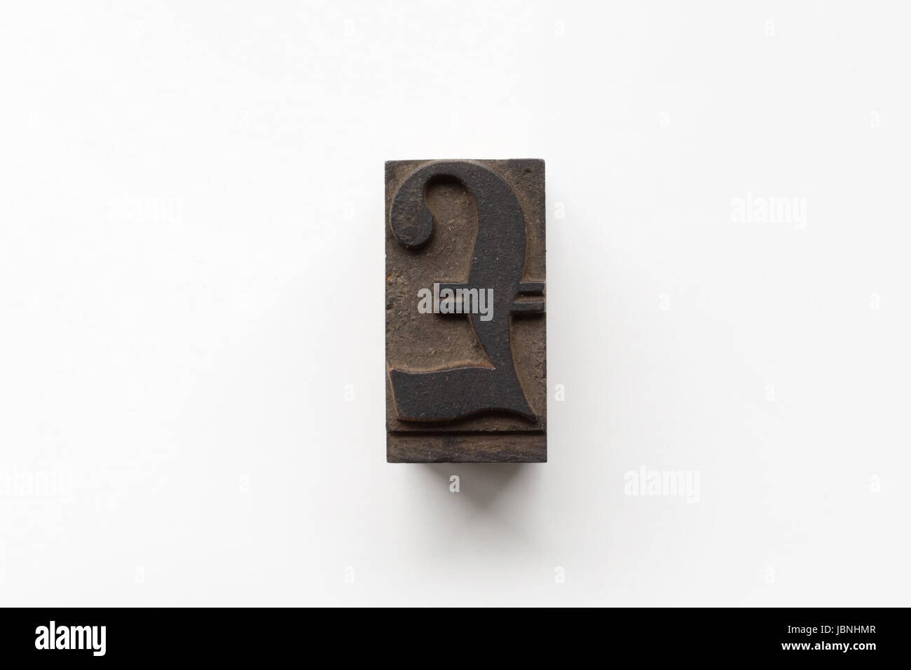 Old letterpress pound sign printing block isolated on a white ...