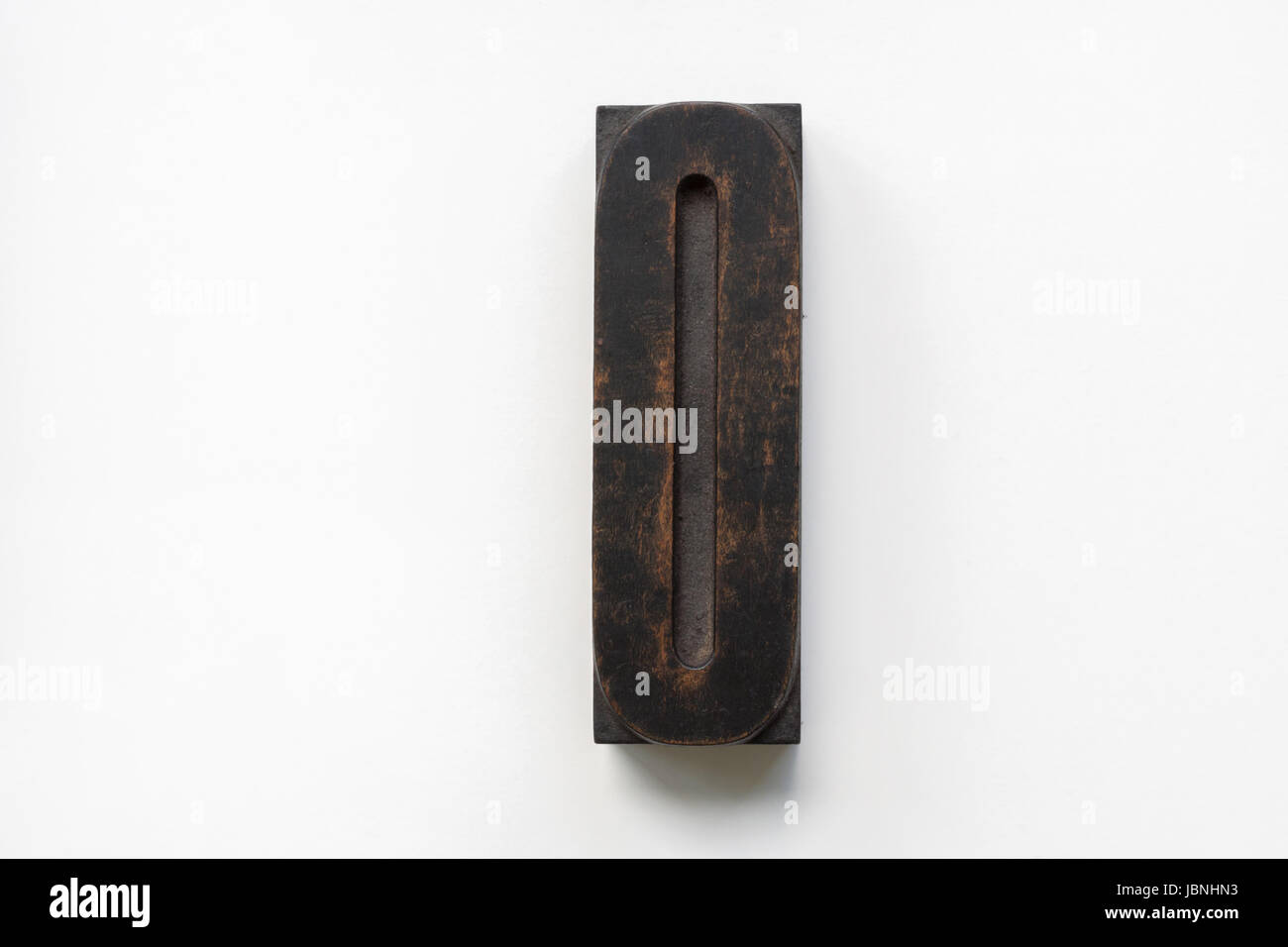 Old letterpress number zero printing block isolated on a white ...