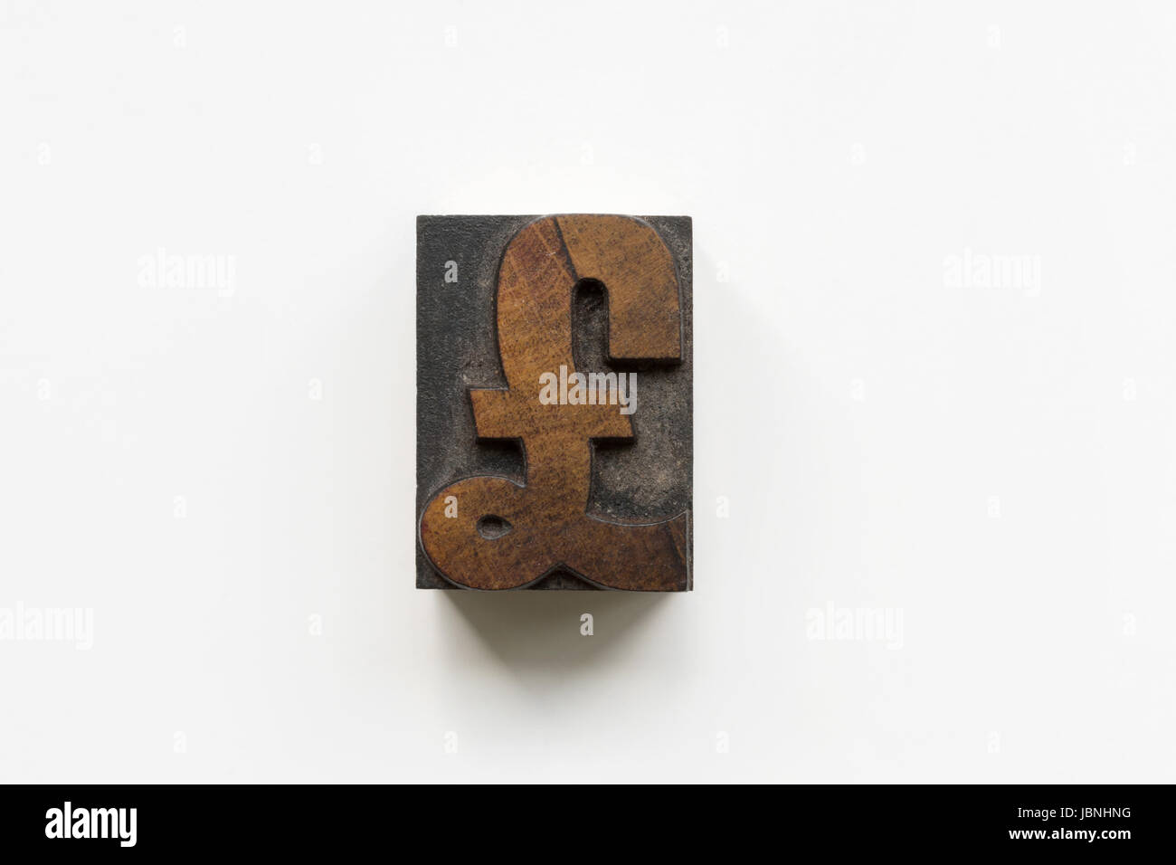 Old letterpress pound sign printing block isolated on a white ...