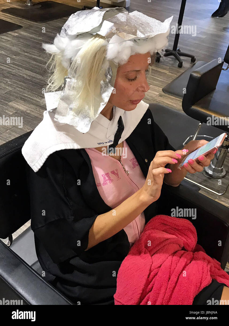 Celebrity hairdresser Zach Mesquit bleaches Frenchy Morgan's hair at ...