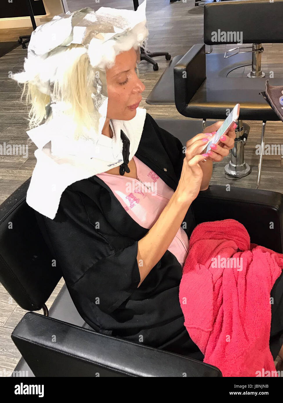 Celebrity hairdresser Zach Mesquit bleaches Frenchy Morgan's hair at ...