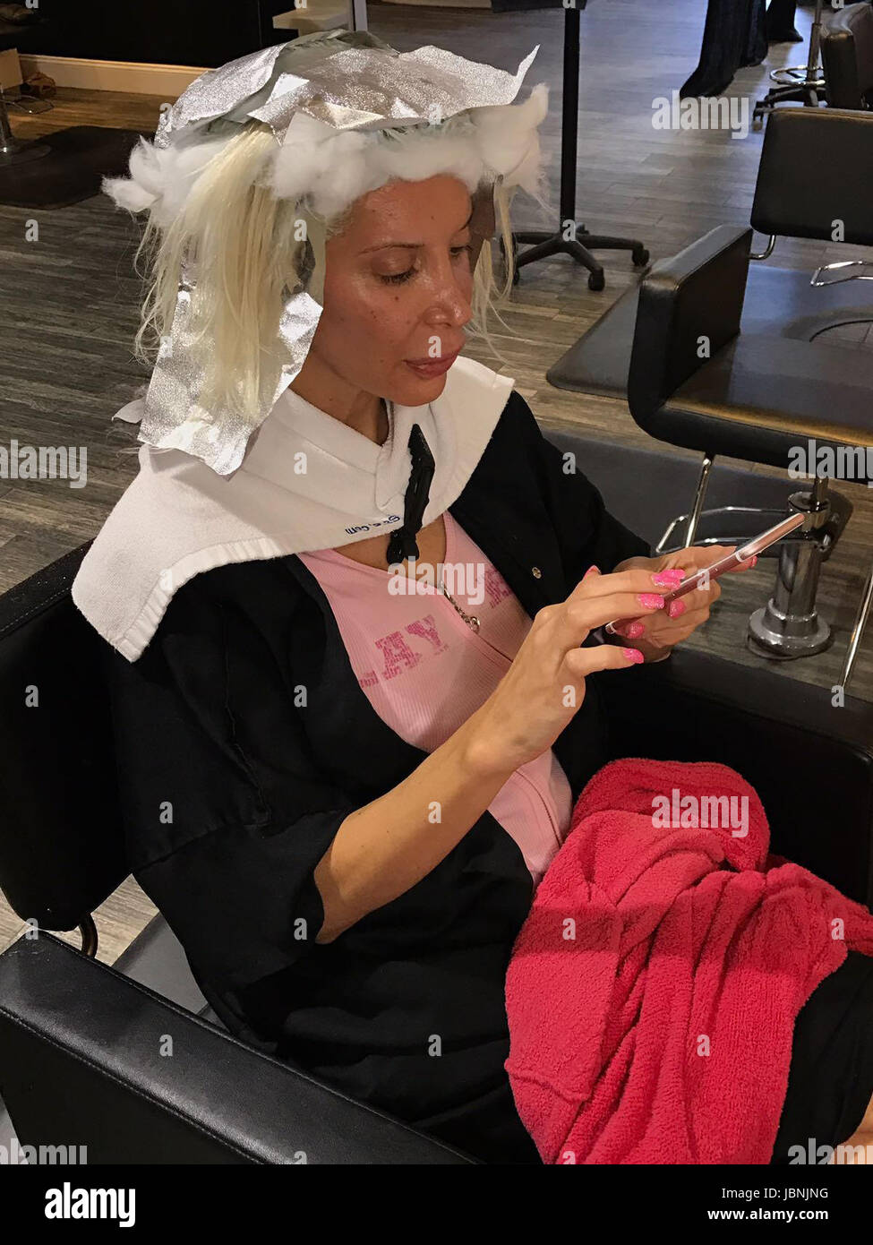 Celebrity hairdresser Zach Mesquit bleaches Frenchy Morgan's hair at ...