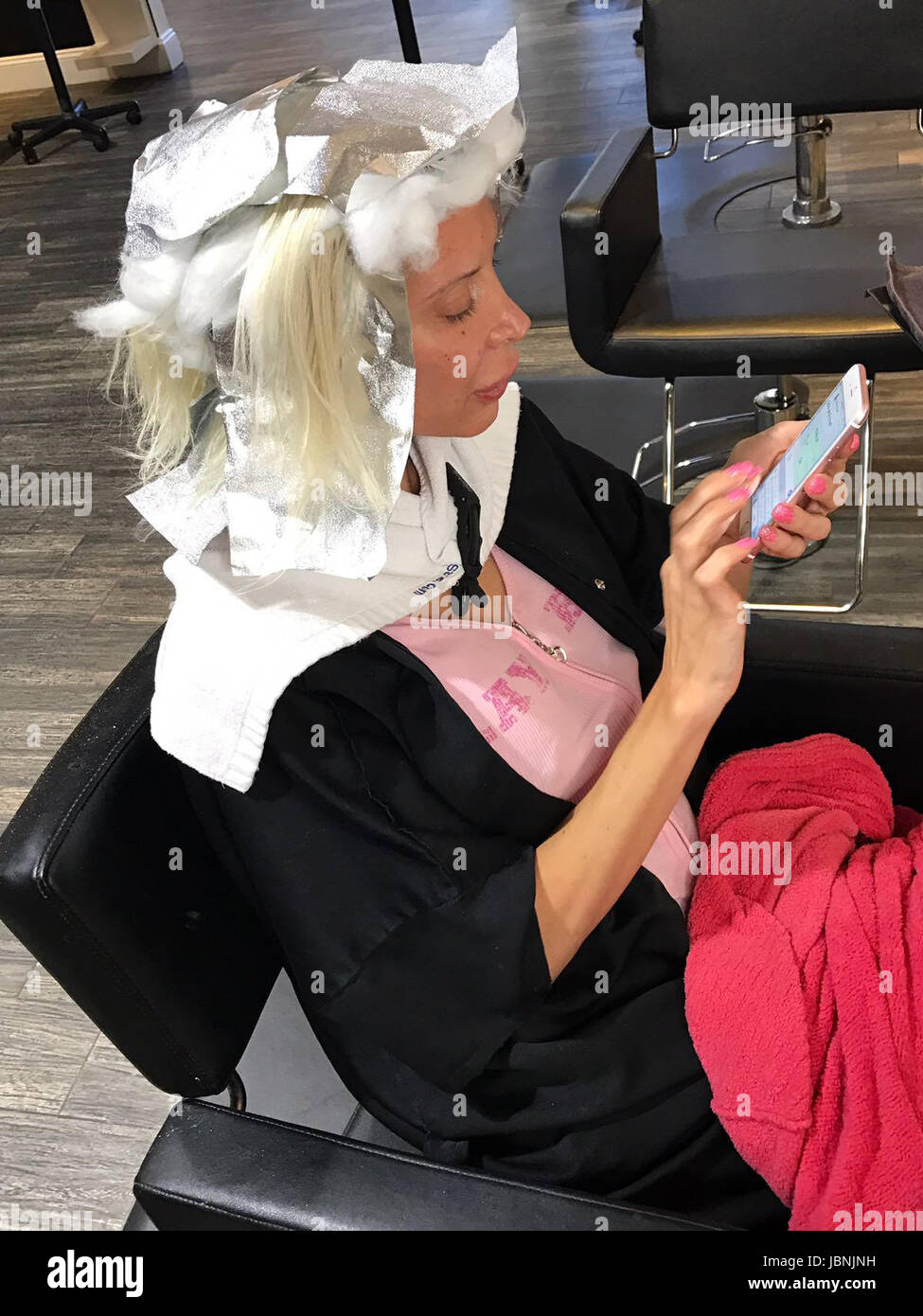 Celebrity hairdresser zach mesquit bleaches hi-res stock photography ...
