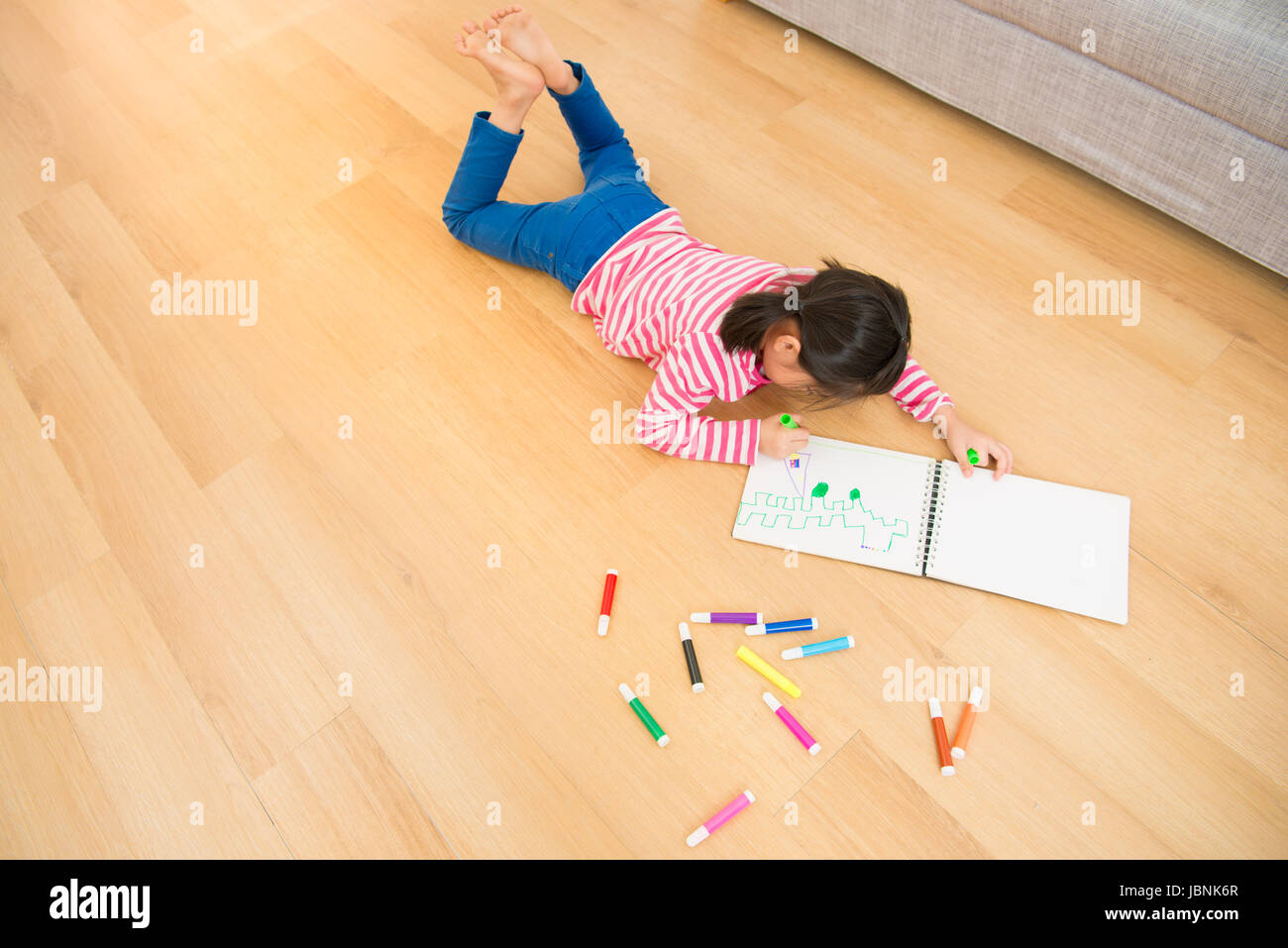 Top above view creative photo of little girl on wooden floor. Children ...