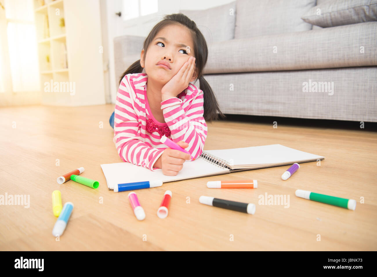 depressed child girl drawing with colorful pen in album using a lot of ...