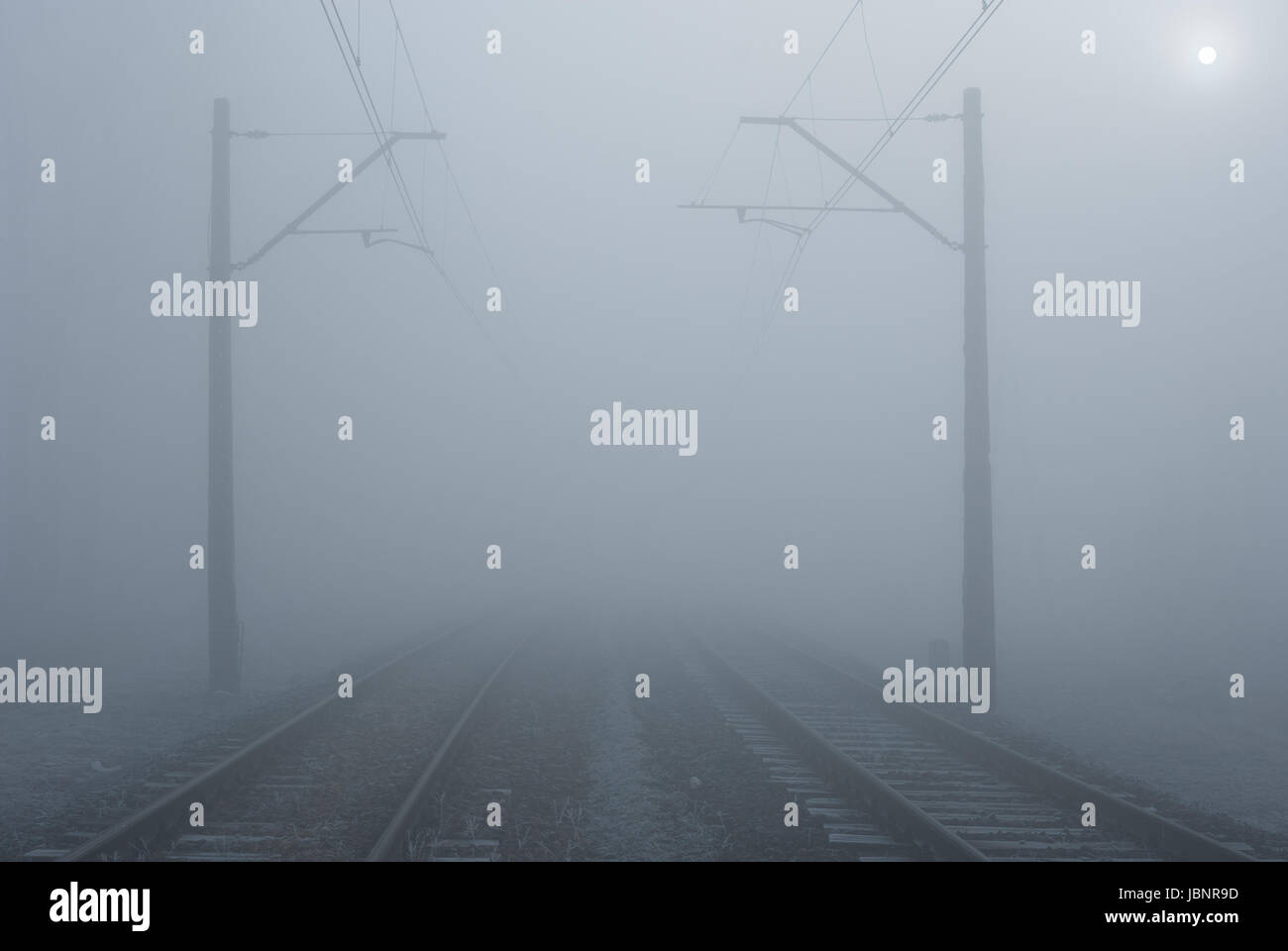 Railroad tracks in the fog Stock Photo - Alamy