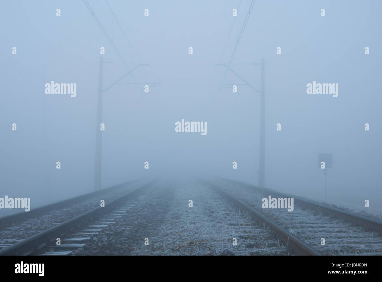 Railroad tracks in the fog Stock Photo - Alamy