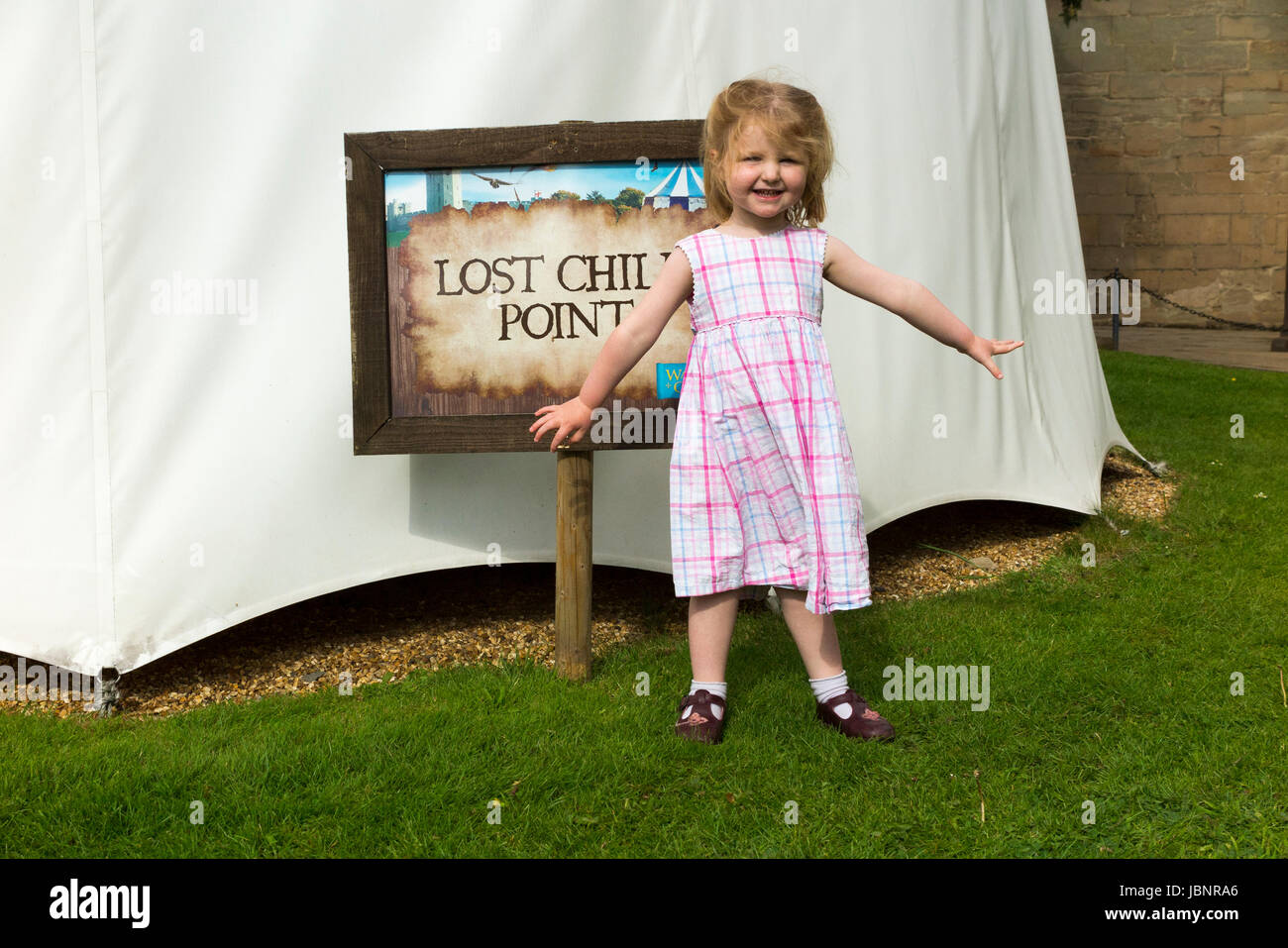 Lost child point sign: A two-year-old girl / kids / infant who appears ...
