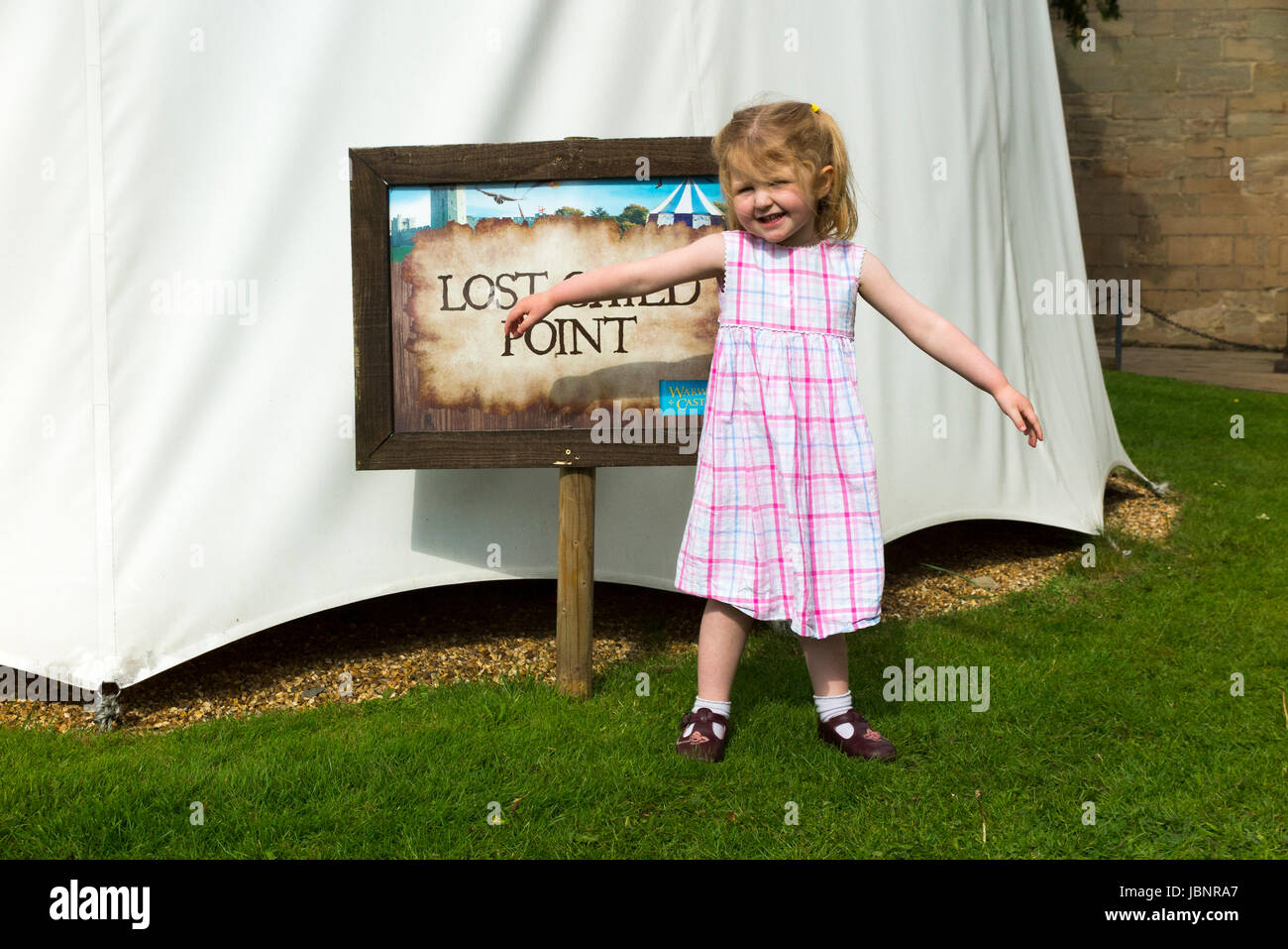 Lost child point sign: A two-year-old girl / kids / infant who appears ...