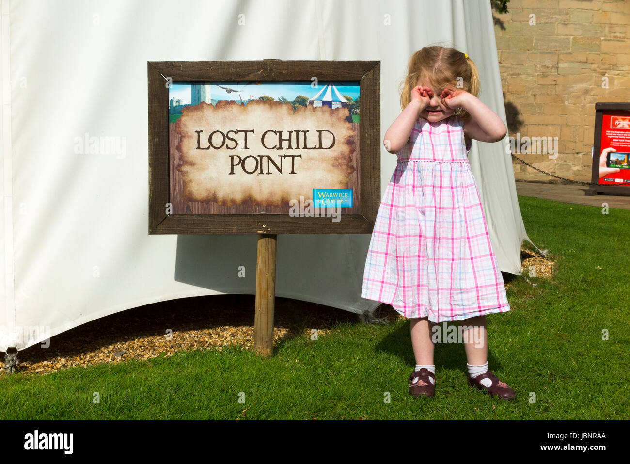 Lost child point sign: A two-year-old girl / kids / infant who appears ...