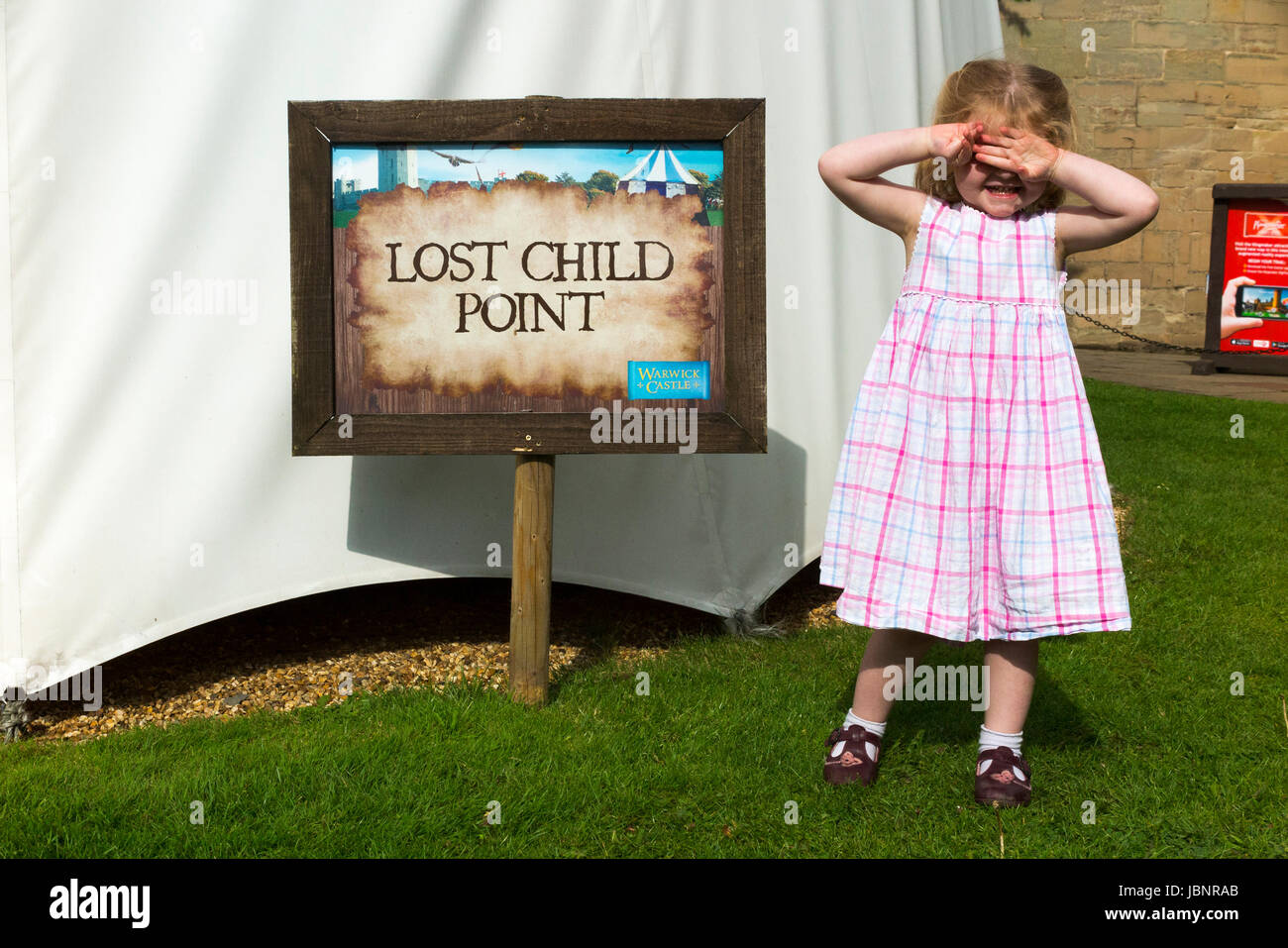 Lost child point sign: A two-year-old girl / kids / infant who appears ...