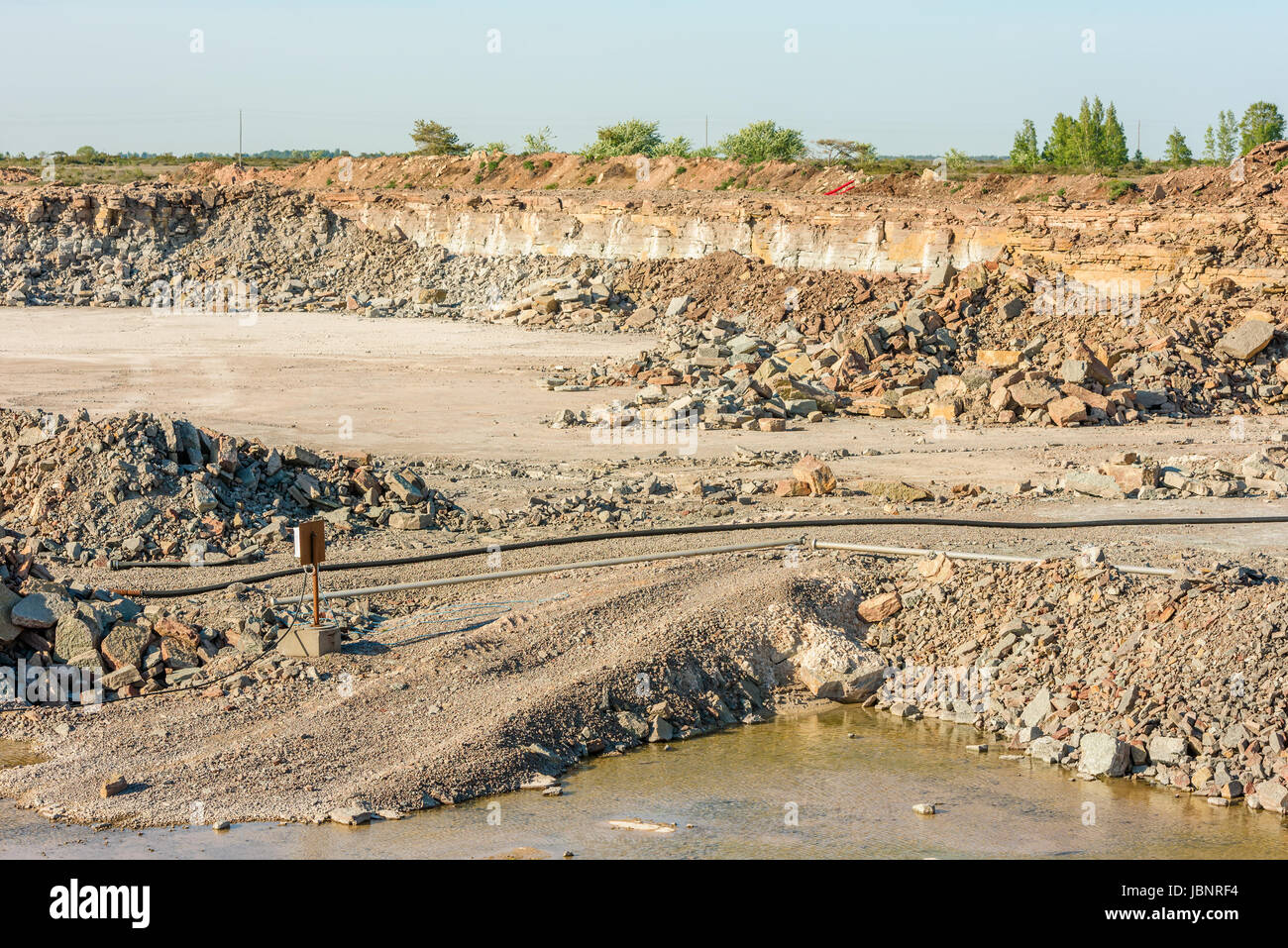 Open limestone quarry with steep sides Stock Photo - Alamy